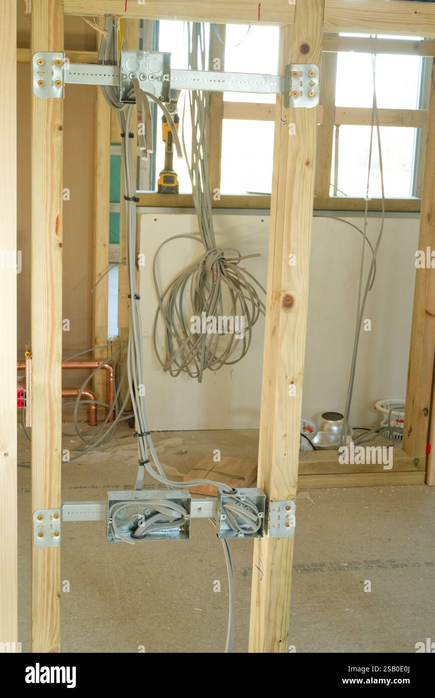 The first fix by electricians in wiring a property. New build wire installation to junction ...