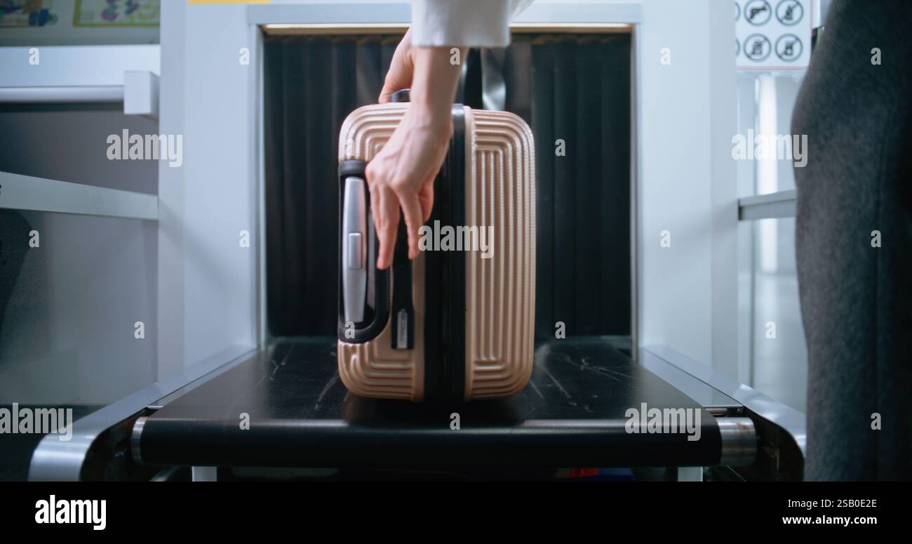 Airport Security Checkpoint: Passenger Takes Suitcase from Conveyor ...