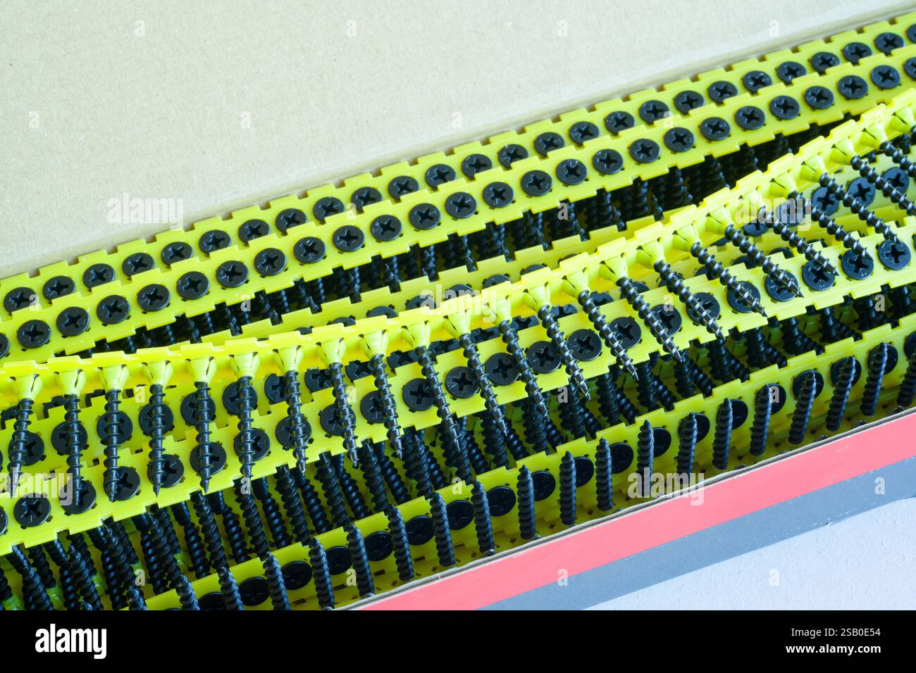 Strips of plasterboard screws ready to be fed into a screw gun Stock ...