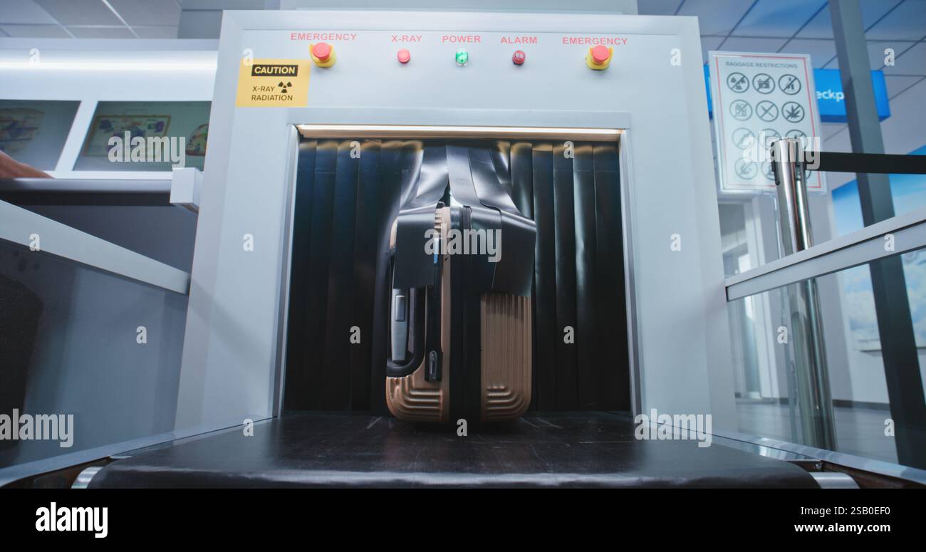 Airport Security Checkpoint: Passenger Takes Suitcase from Conveyor ...