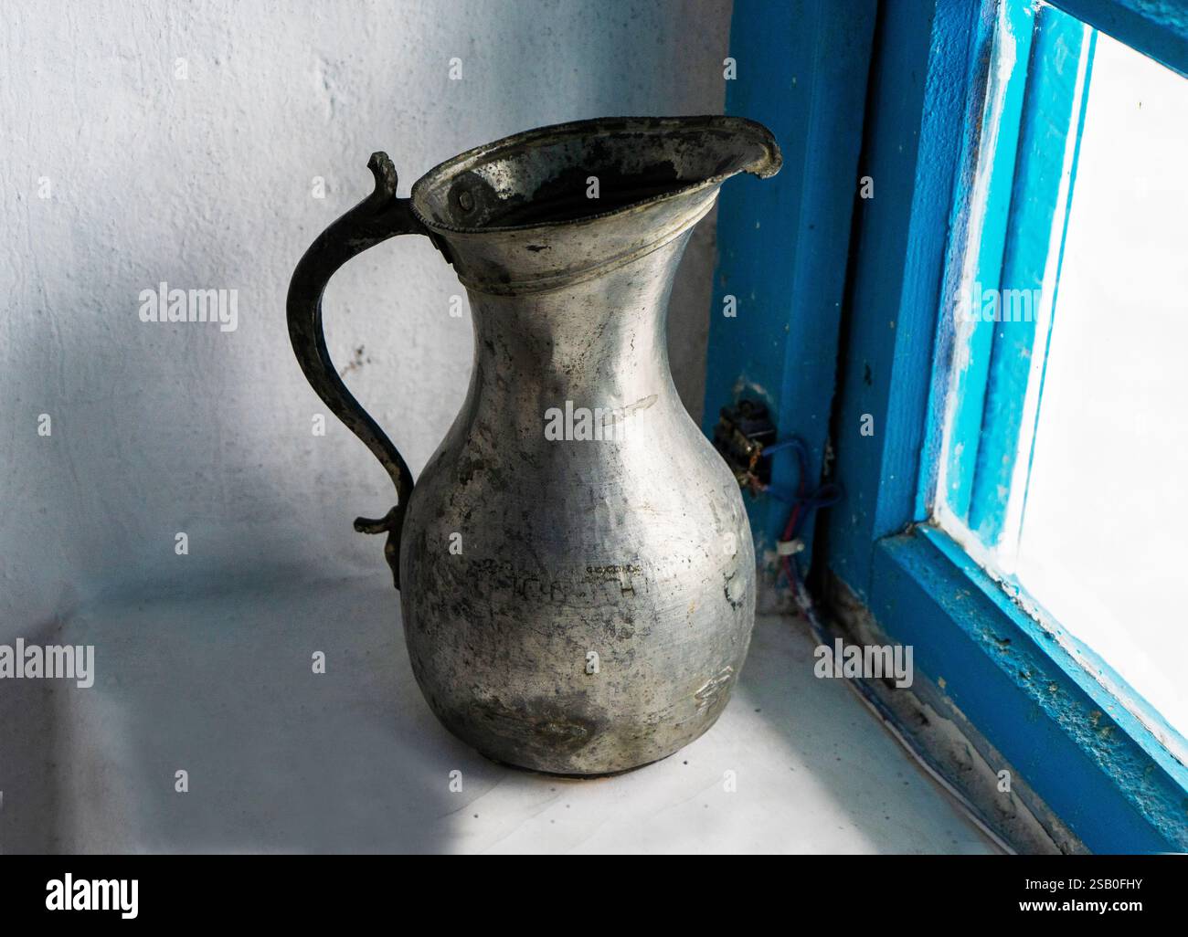 A beautiful, antique, oriental, cast-iron, iron jug for water, milk ...