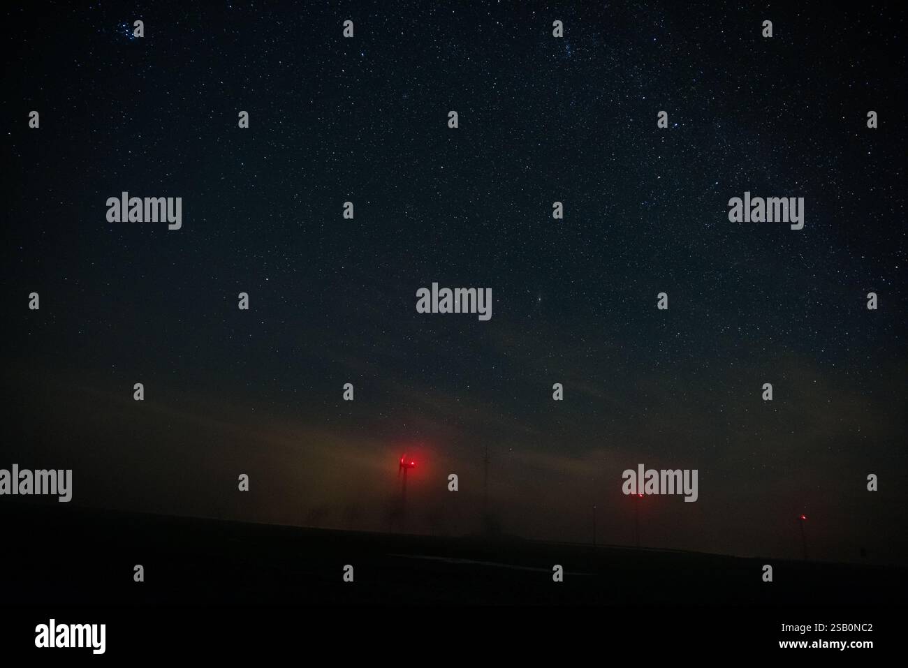 Wind power plant without light polution and sky full of the stars ...