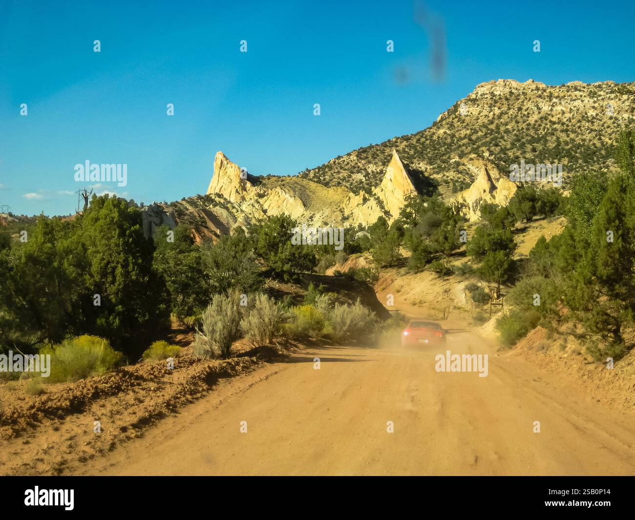 Car leaving dusty road hi-res stock photography and images - Alamy