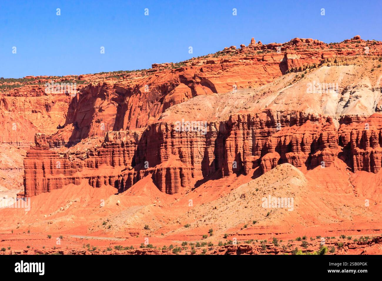 A beautiful, rocky landscape with a blue sky in the background. The ...