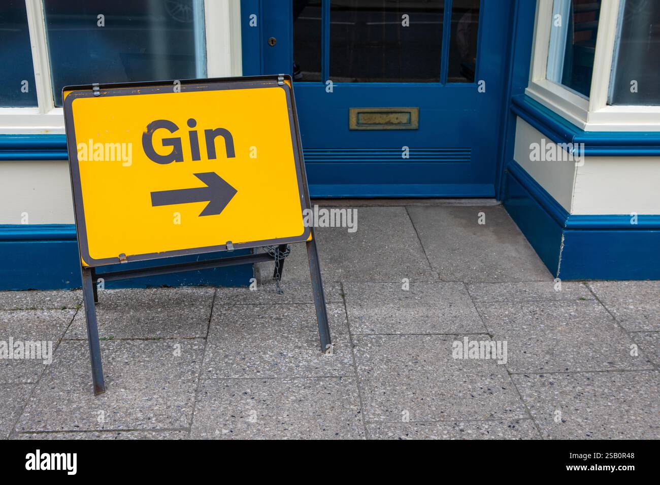 A sign pointing people to the direction of Gin Stock Photo - Alamy