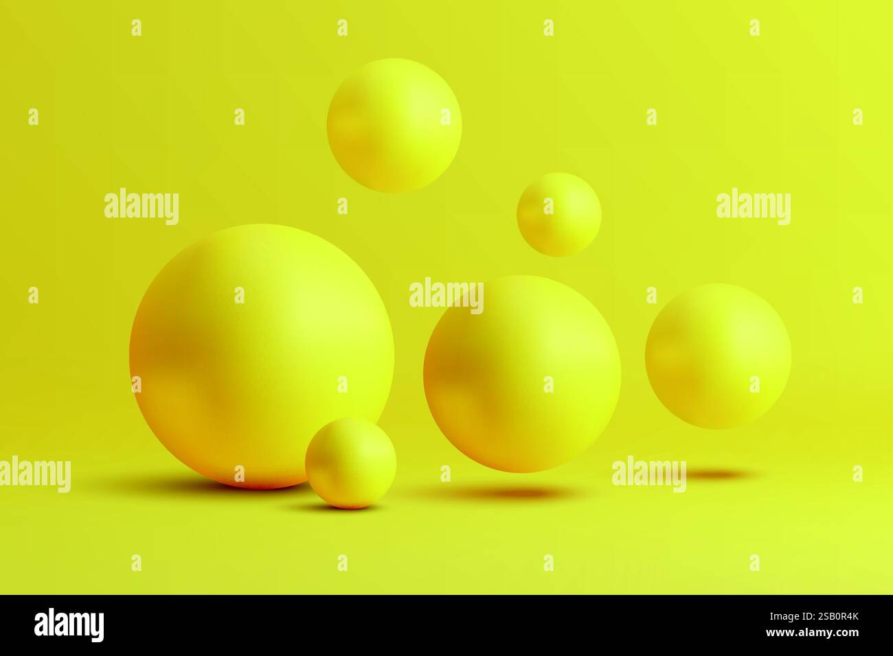 Glossy yellow spheres resting and floating on a vibrant yellow surface ...