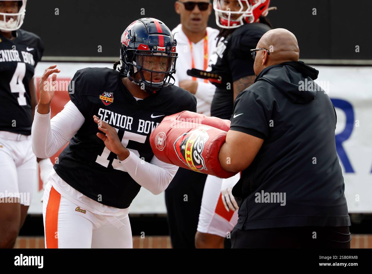 American team defensive lineman Jared Ivey of Mississippi (15) runs ...
