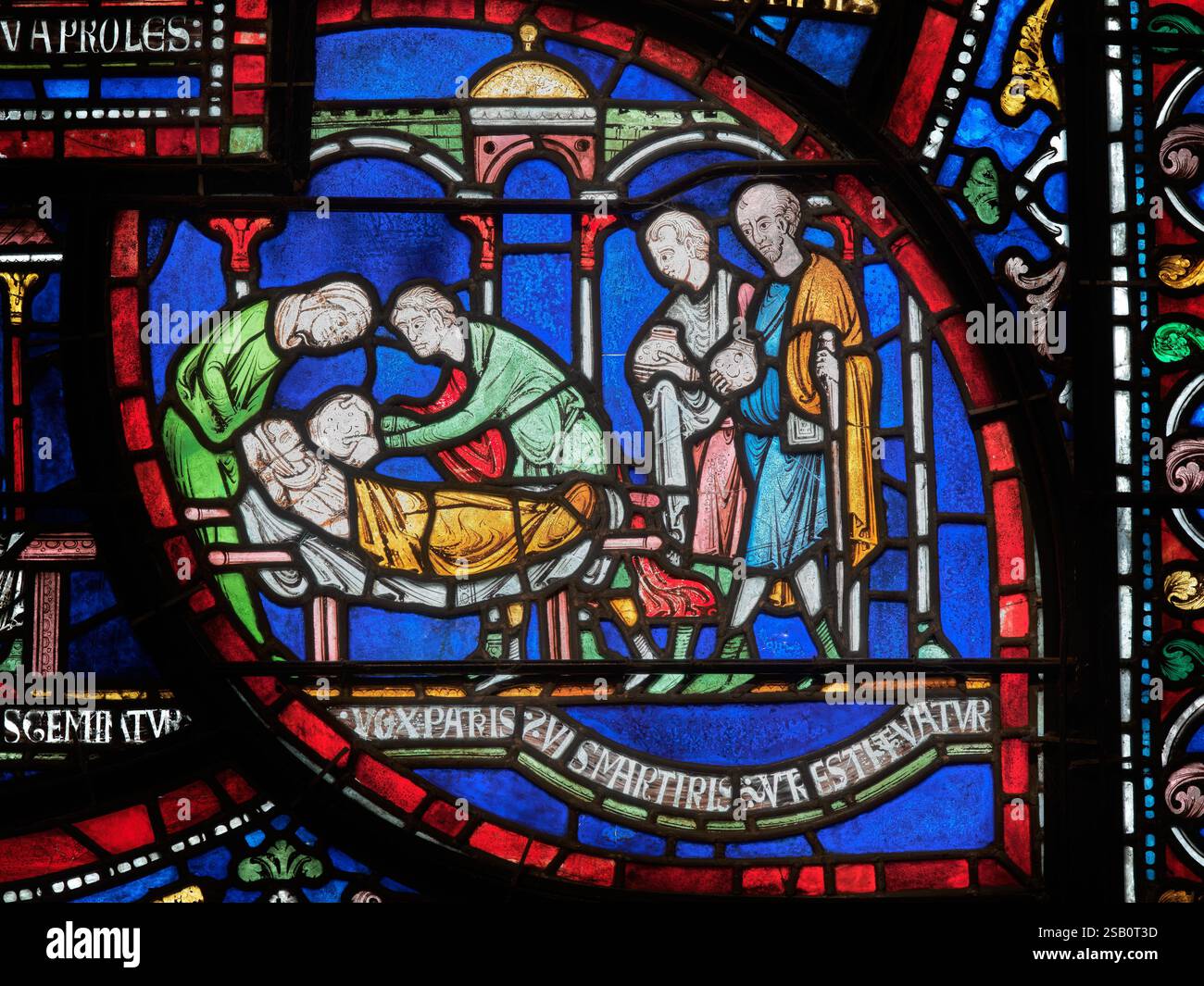 Medieval stained glass window, of ministering to a sick person,, in the ...