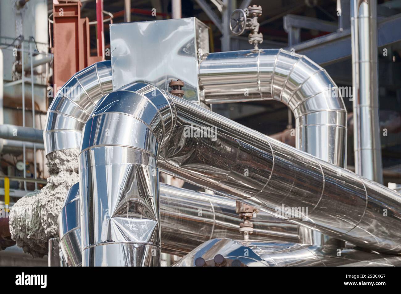Pipes and industrial structures within a chemical plant during daylight ...