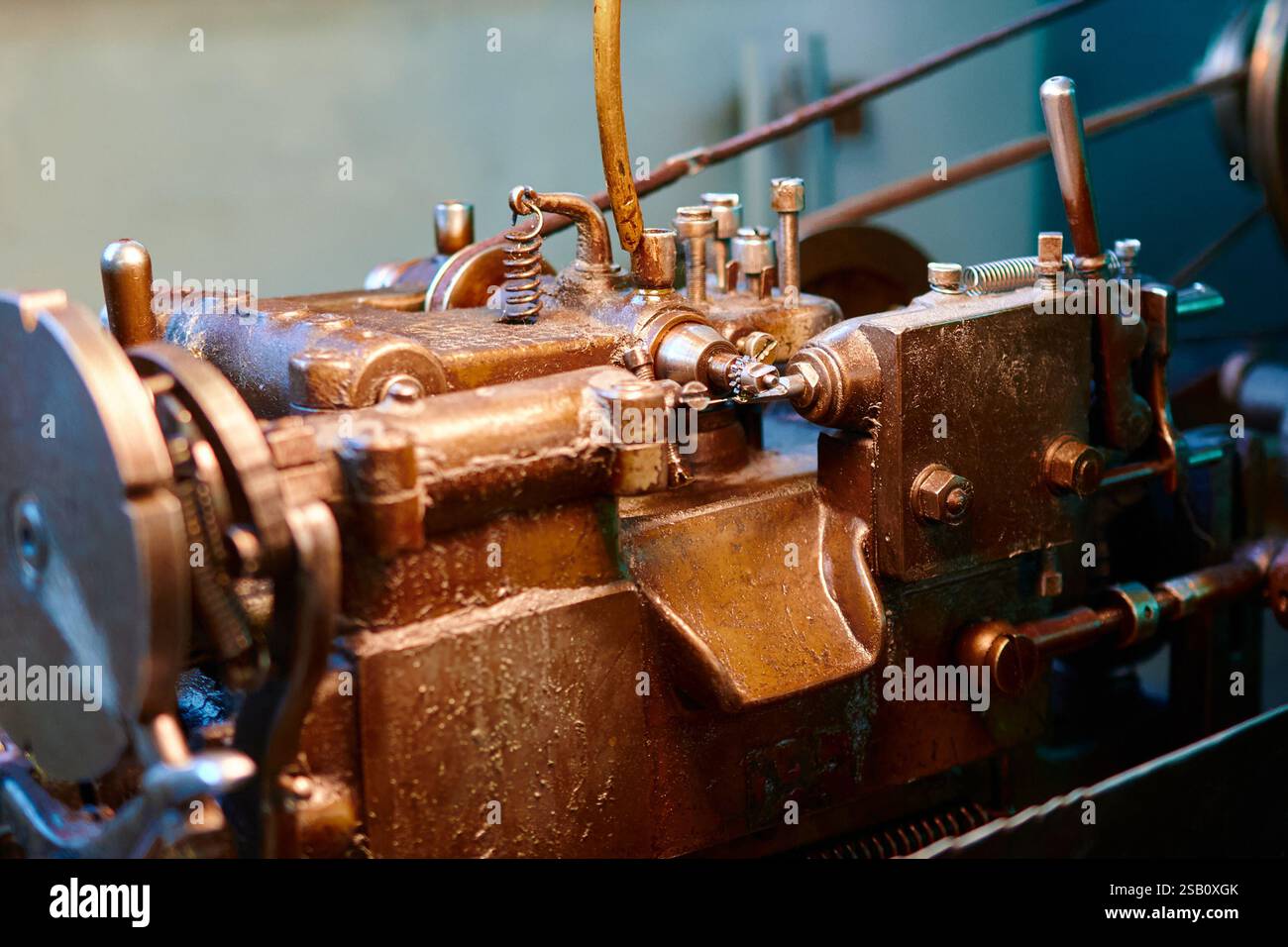 Precision milling machine shaping a clockwork pinion shaft in a ...