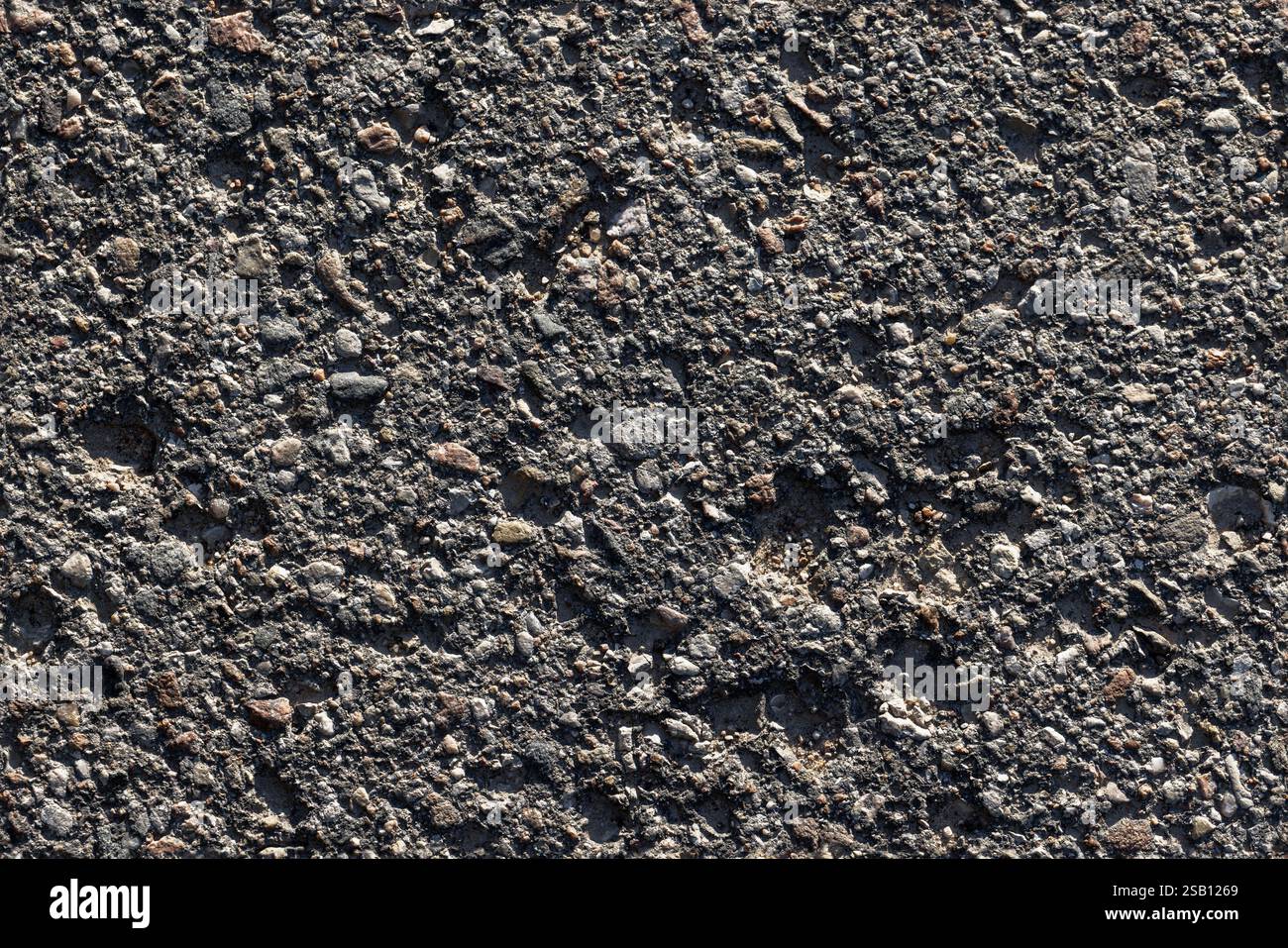 Grungy old road surface. Tarmac texture, dark road pavement consisting ...