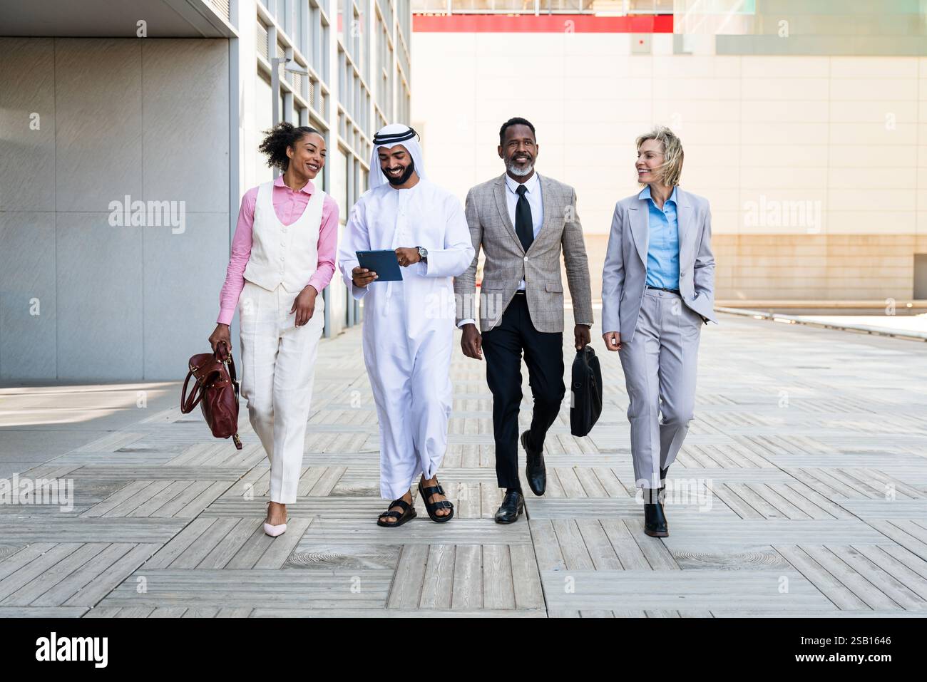 Group of multiethnic business people meeting an emirati businessman ...