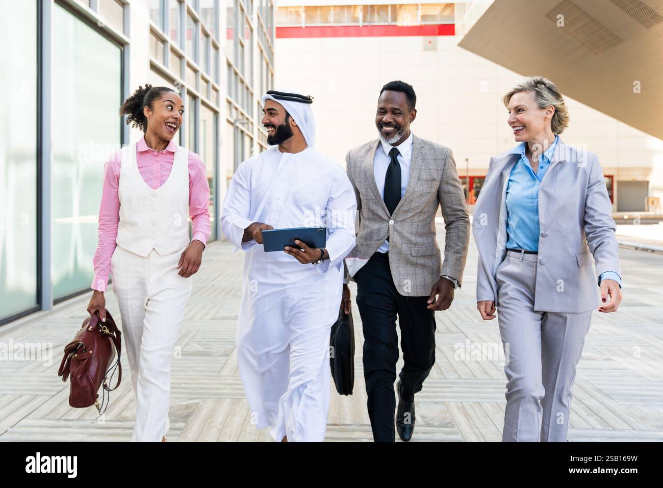 Group of multiethnic business people meeting an emirati businessman ...