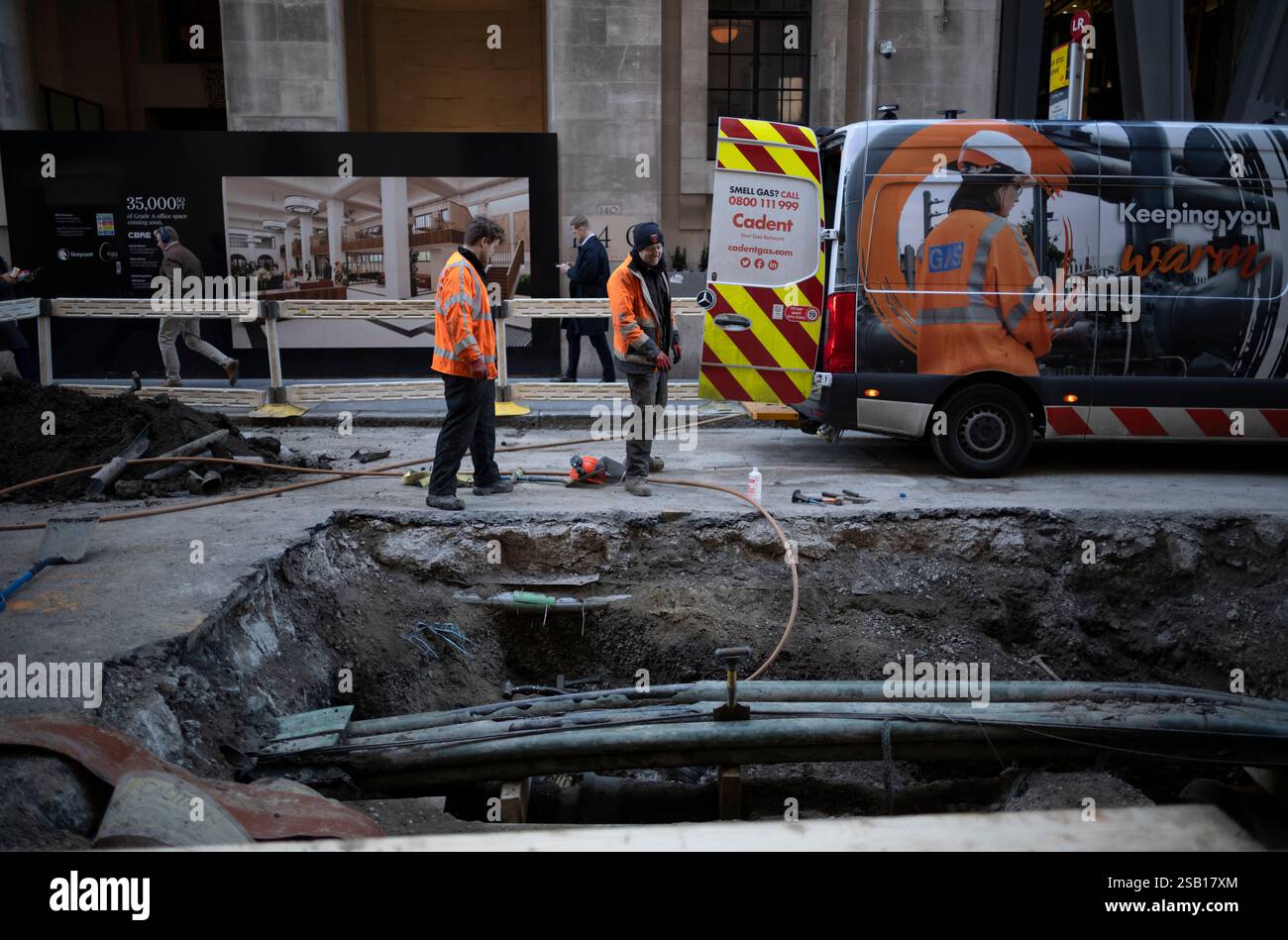 Cadent gas workers, renewing gas pipes along Leadenhall Street in the ...