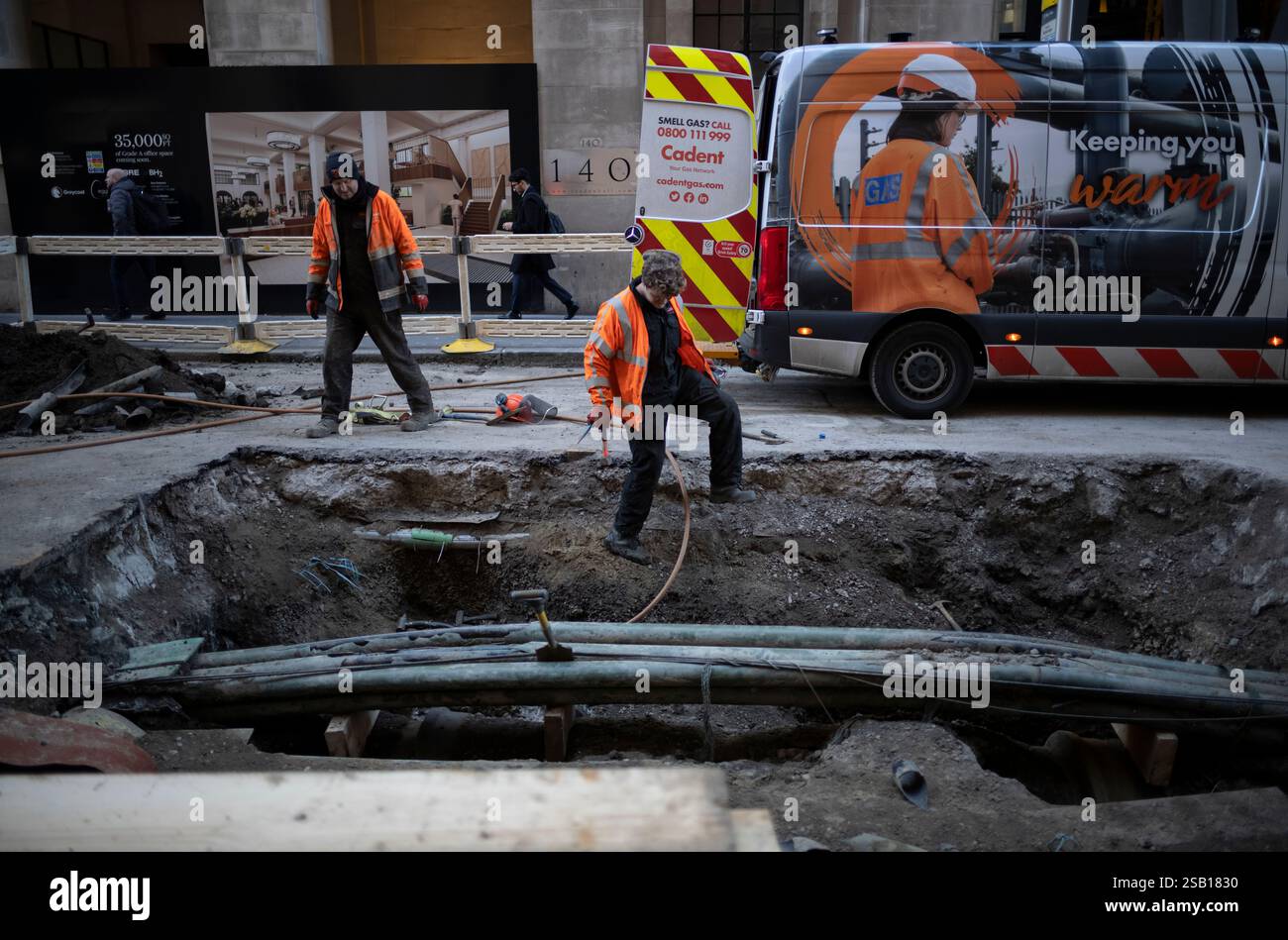 Cadent gas workers, renewing gas pipes along Leadenhall Street in the ...