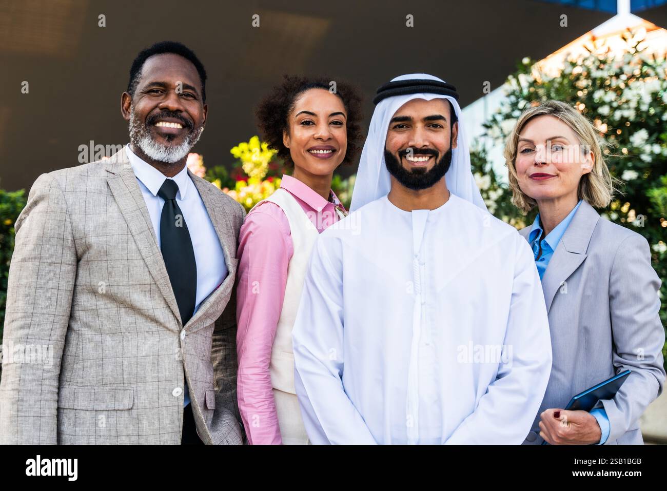 Group of multiethnic business people meeting an emirati businessman ...