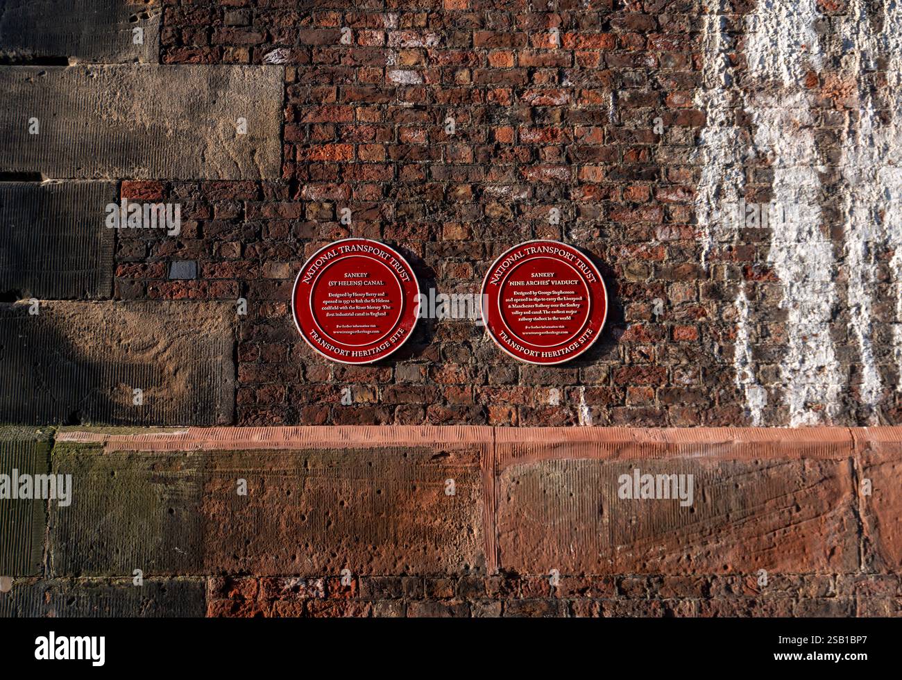 Red heritage plaques on the brickwork of the Sankey Viaduct (Nine ...