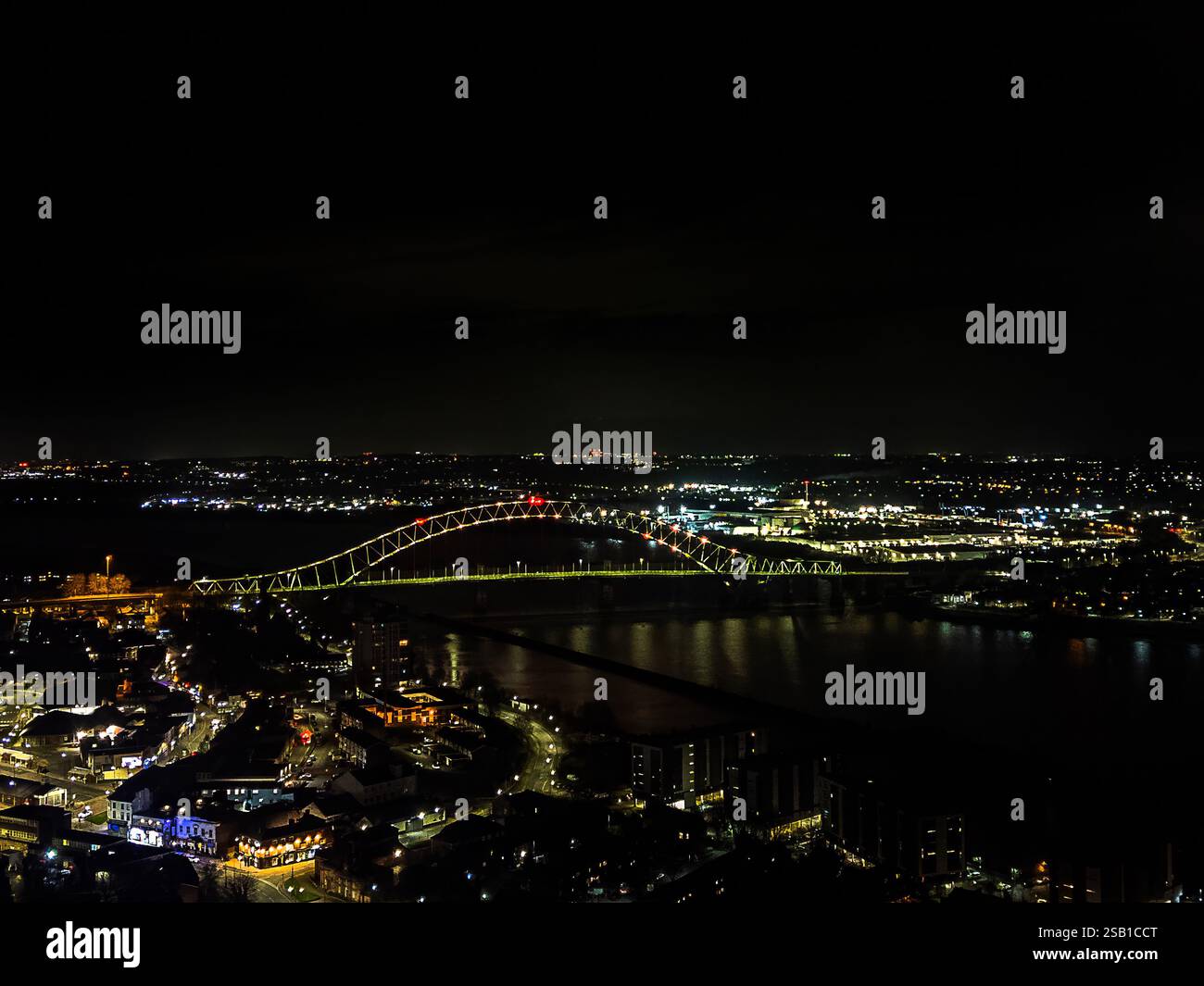 An aerial view of the Silver Jubilee Bridge at night crossing the River ...