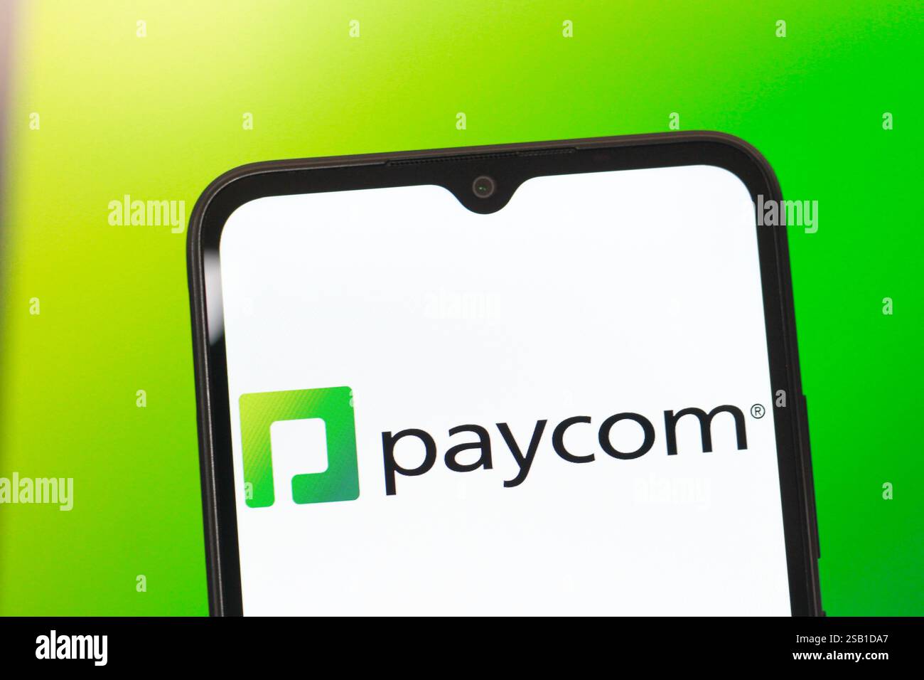 In this photo illustration, the Paycom Software, Inc. logo is seen displayed on a smartphone ...
