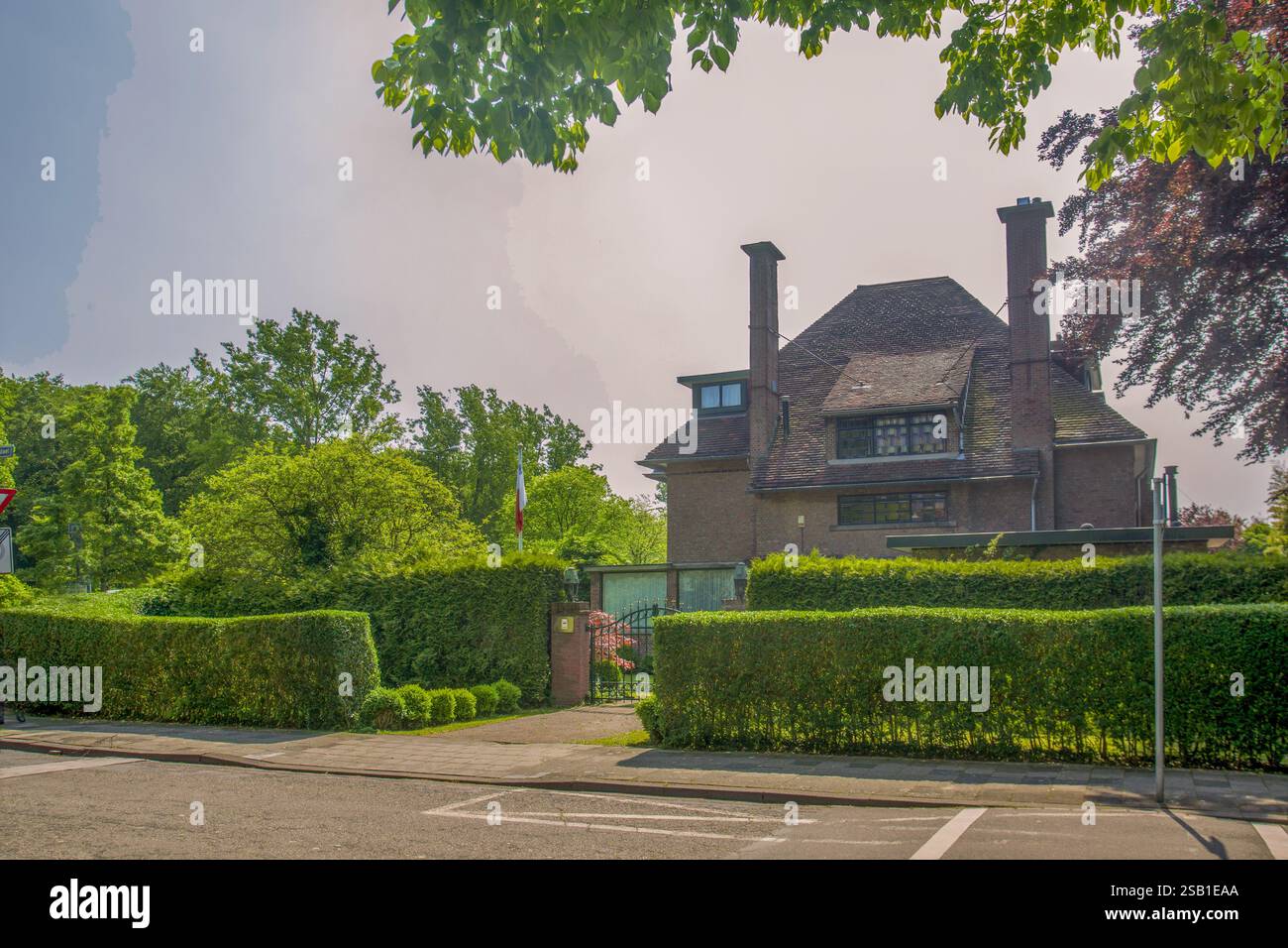 Stunning Dutch house in distance in the suburbs of The Hague and cars ...