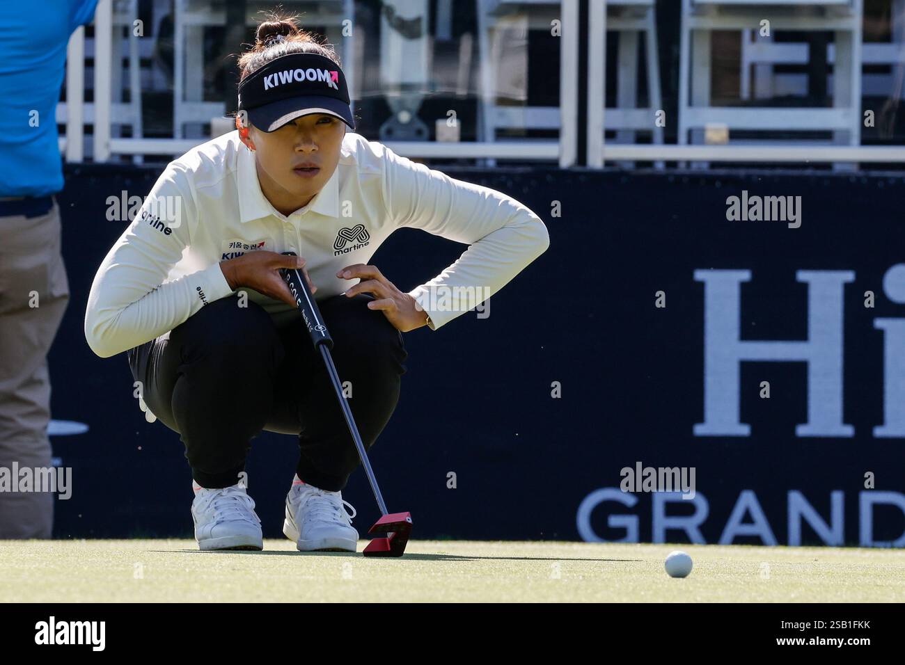 Amy Yang lines up her putt on the ninth green during the first round of ...