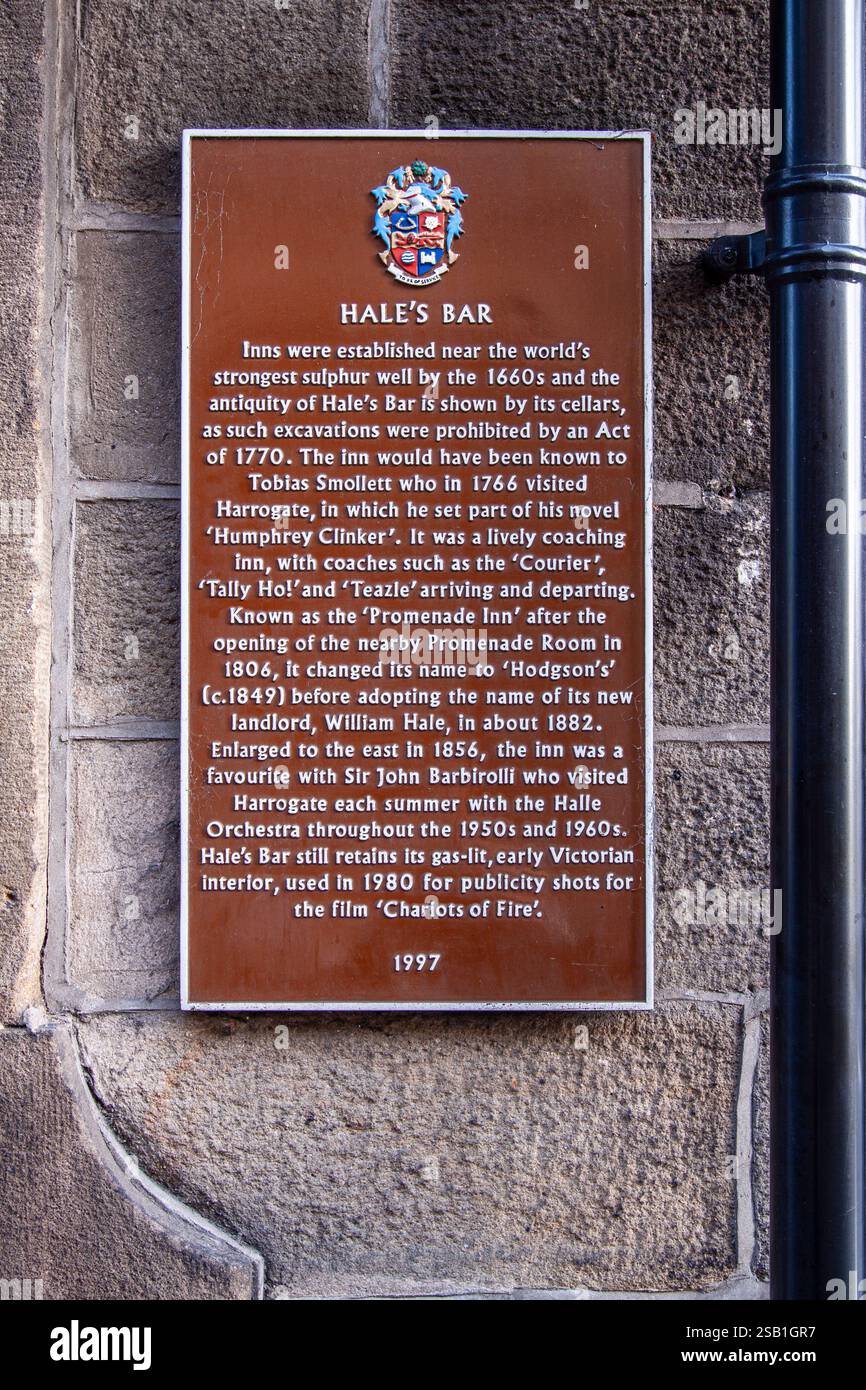 Sign giving history of old coaching inn Hale's Bar with its gas lit ...