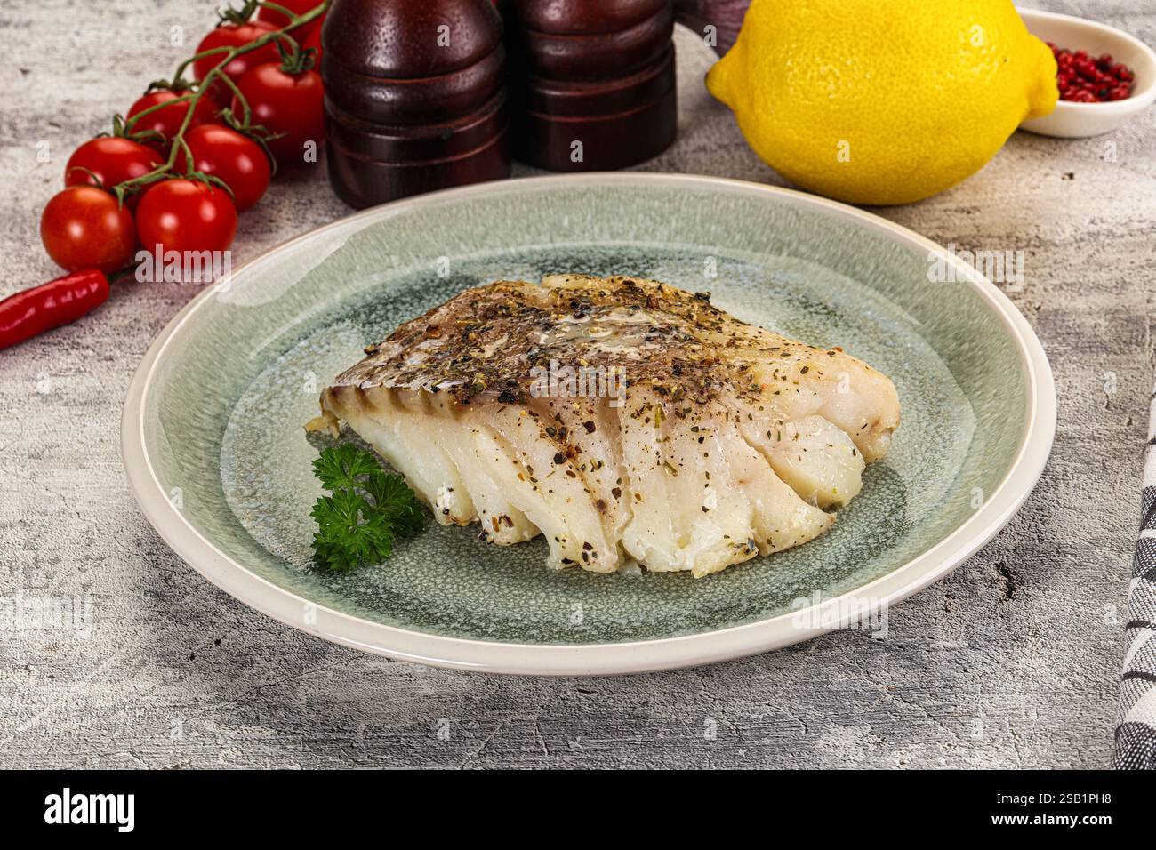 Dietary Baked cod fish fillet with spices Stock Photo - Alamy