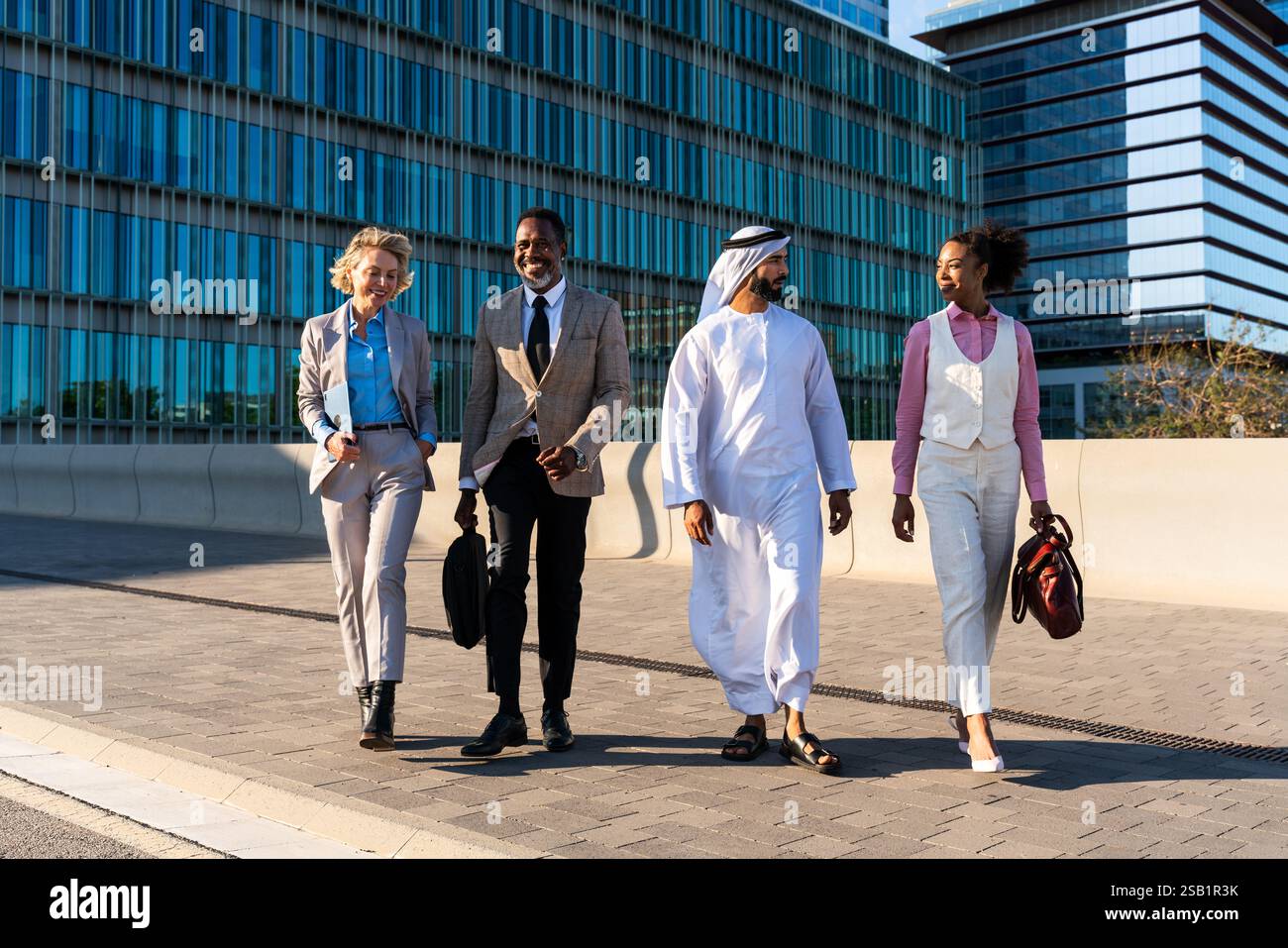 Group of multiethnic business people meeting an emirati businessman ...