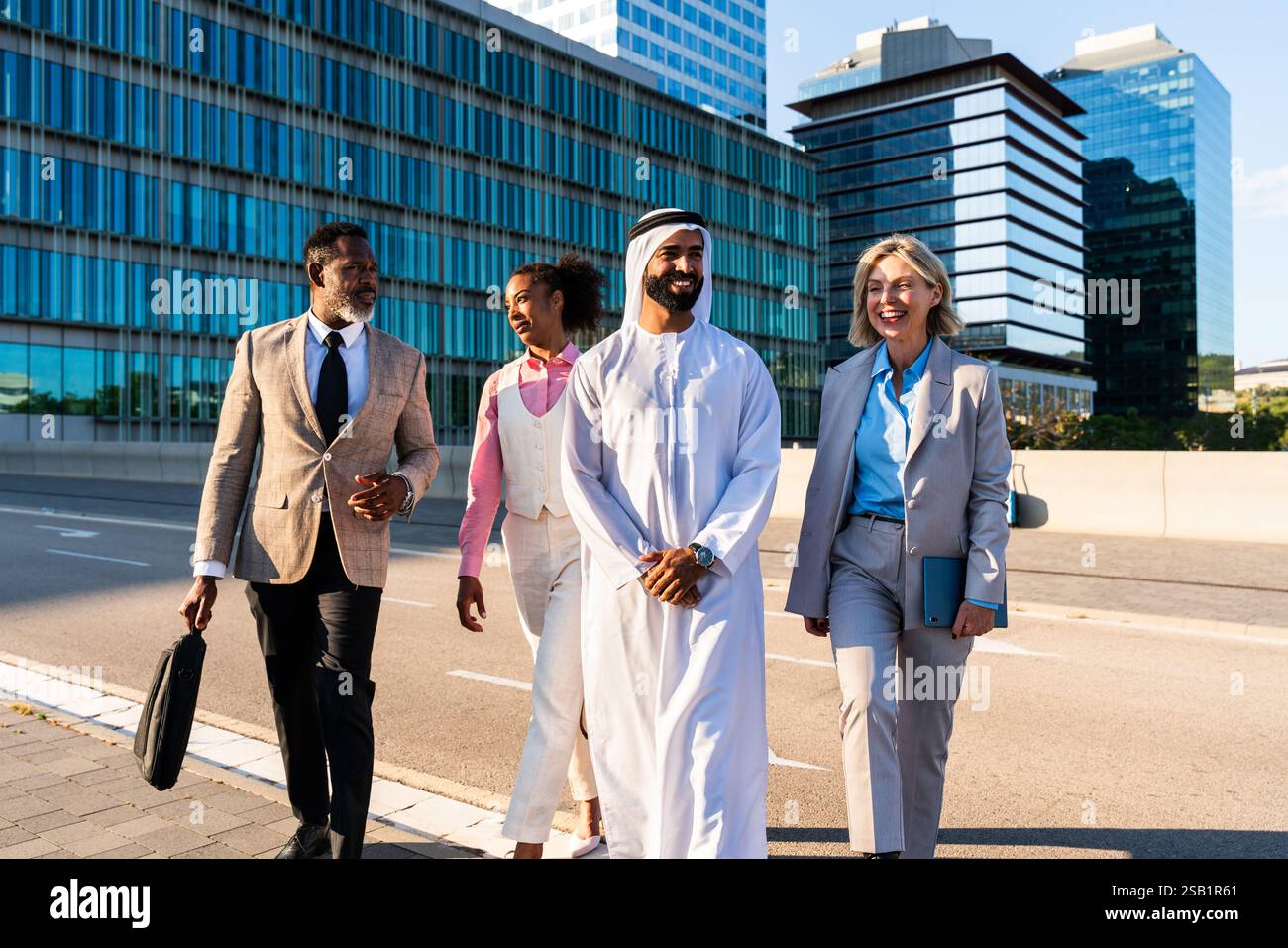 Group of multiethnic business people meeting an emirati businessman ...