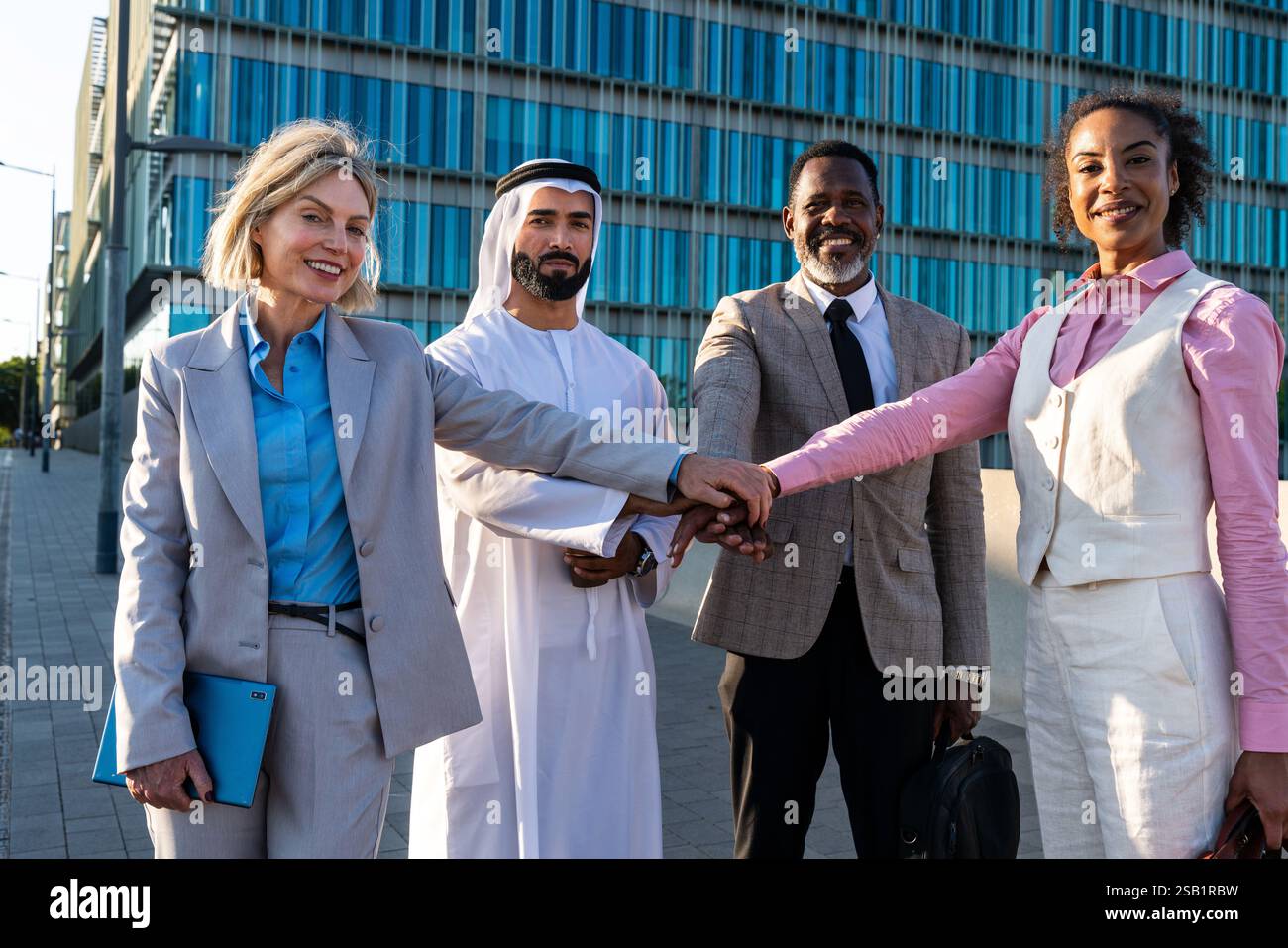 Group of multiethnic business people meeting an emirati businessman ...