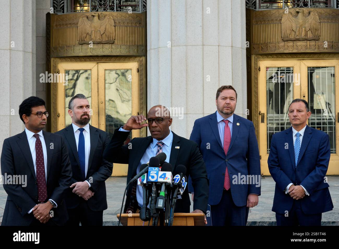 FBI Assistant Director Akil Davis, center joined by Acting U.S ...