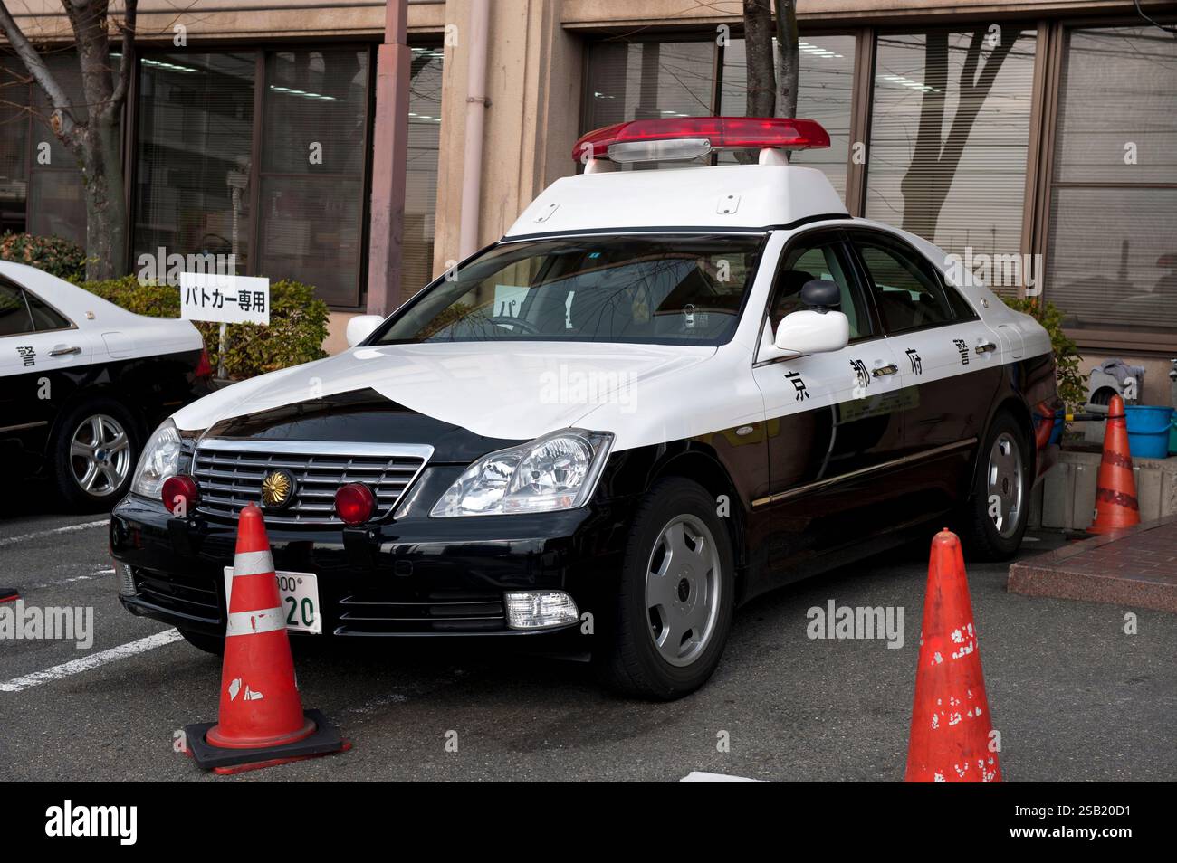 Black and White Japanese police patrol car parked in a parking lot ...