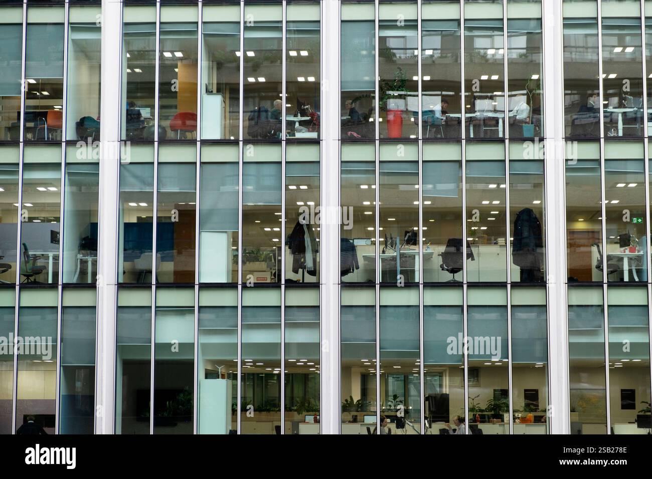 Exterior view of offices from the outside with office workers people ...