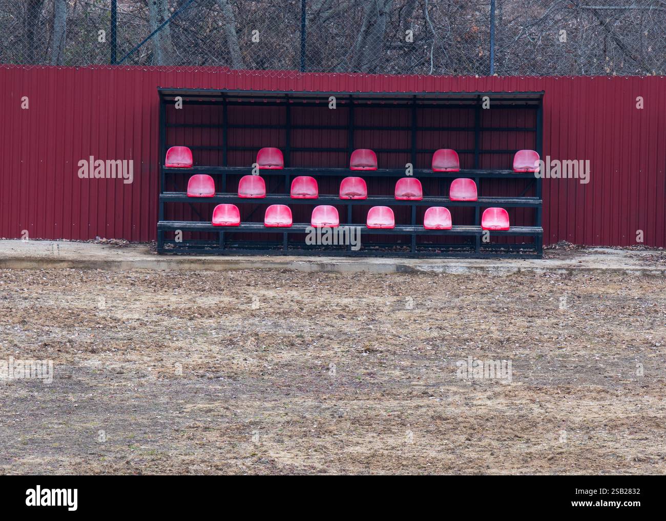 Silent Sidelines – Empty Black Bench and Faded Red Chairs on Football ...