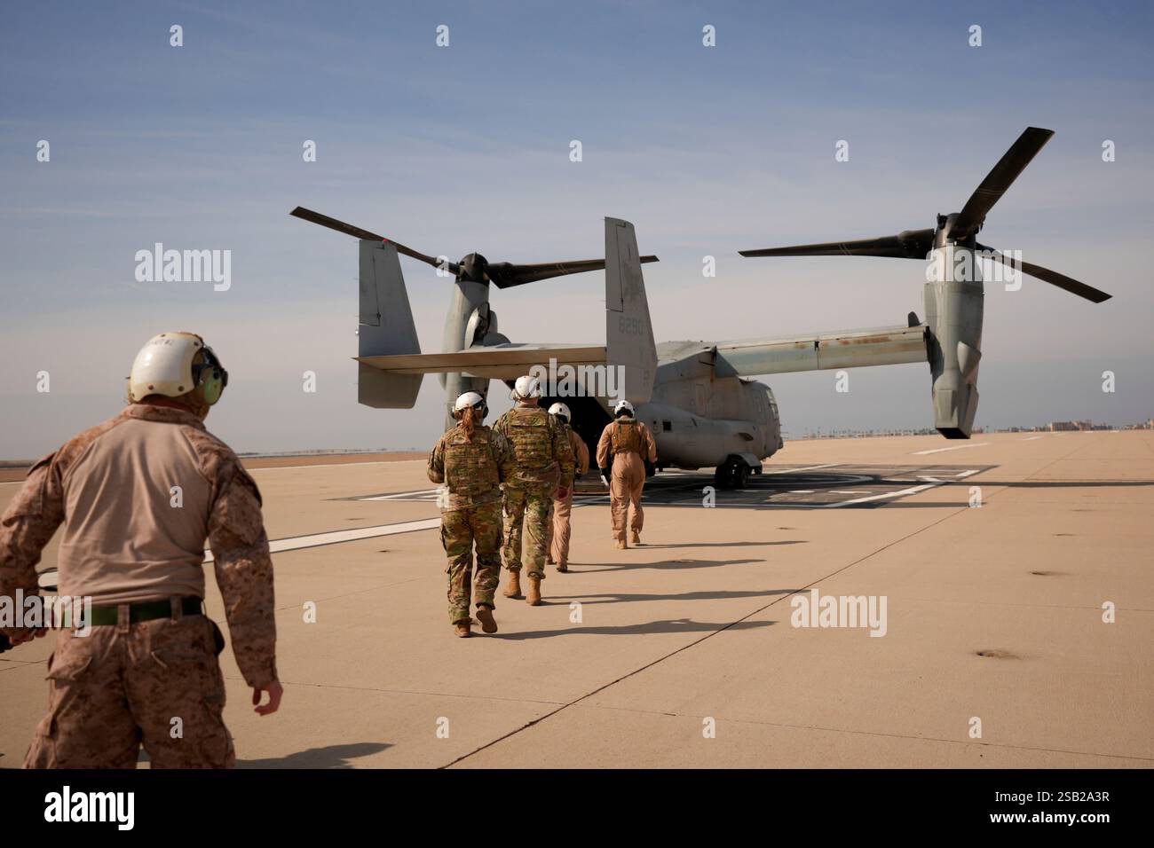 Military personnel board a U.S. Marine Osprey at the Naval Outlying ...