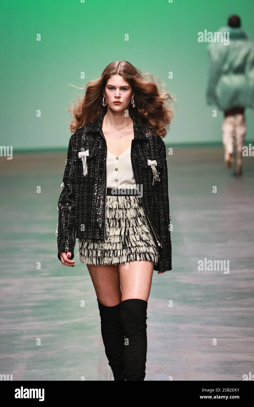 BERLIN, GERMANY - January 31: A model walks the runway during the ...
