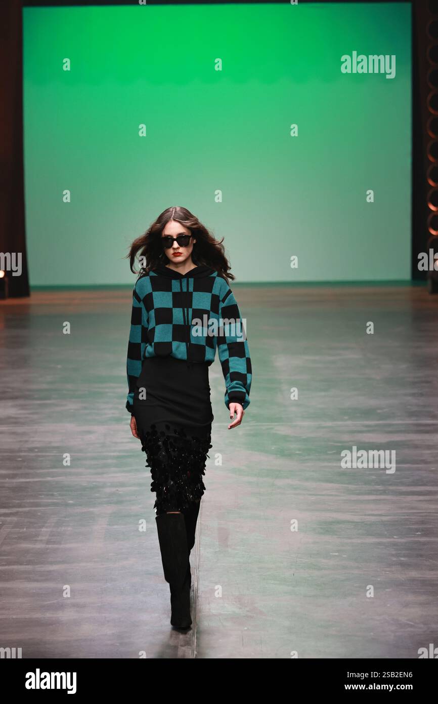 BERLIN, GERMANY - January 31: A model walks the runway during the ...