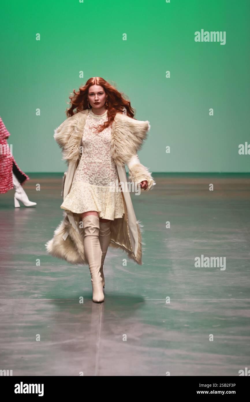 BERLIN, GERMANY - January 31: A model walks the runway during the ...