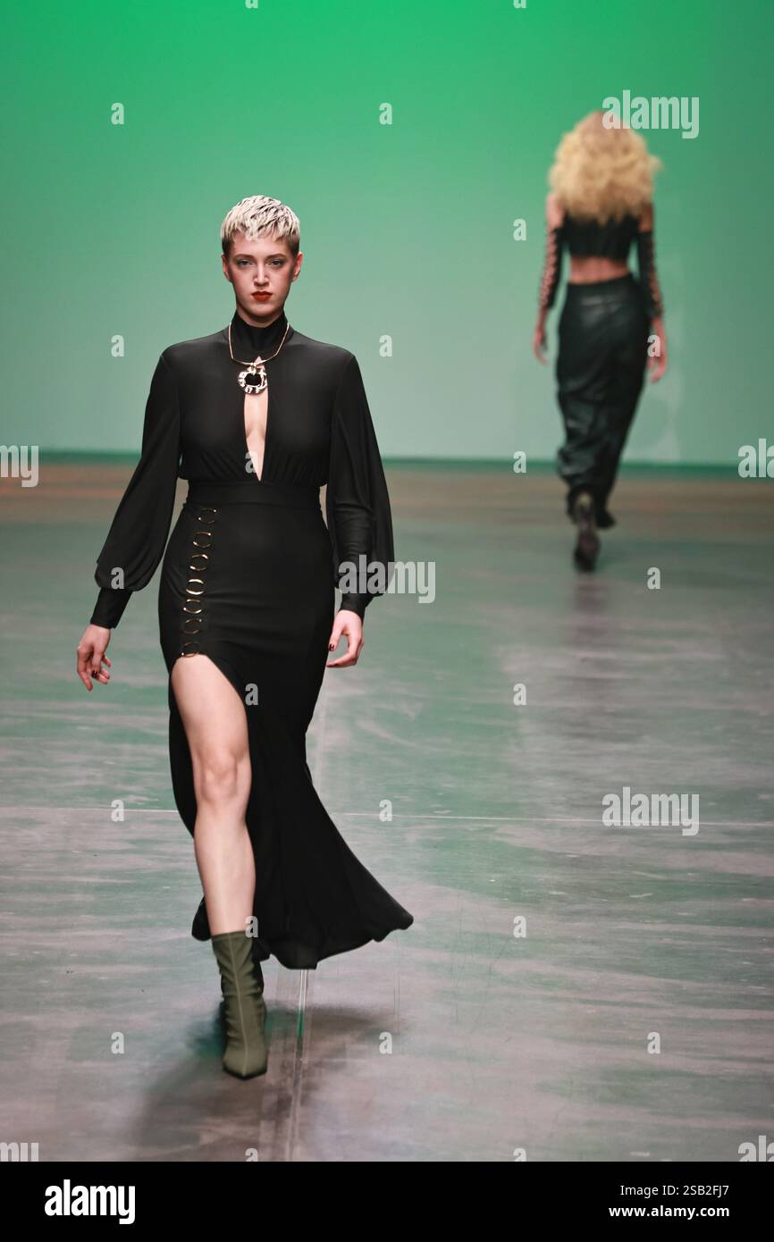 BERLIN, GERMANY - January 31: A model walks the runway during the ...