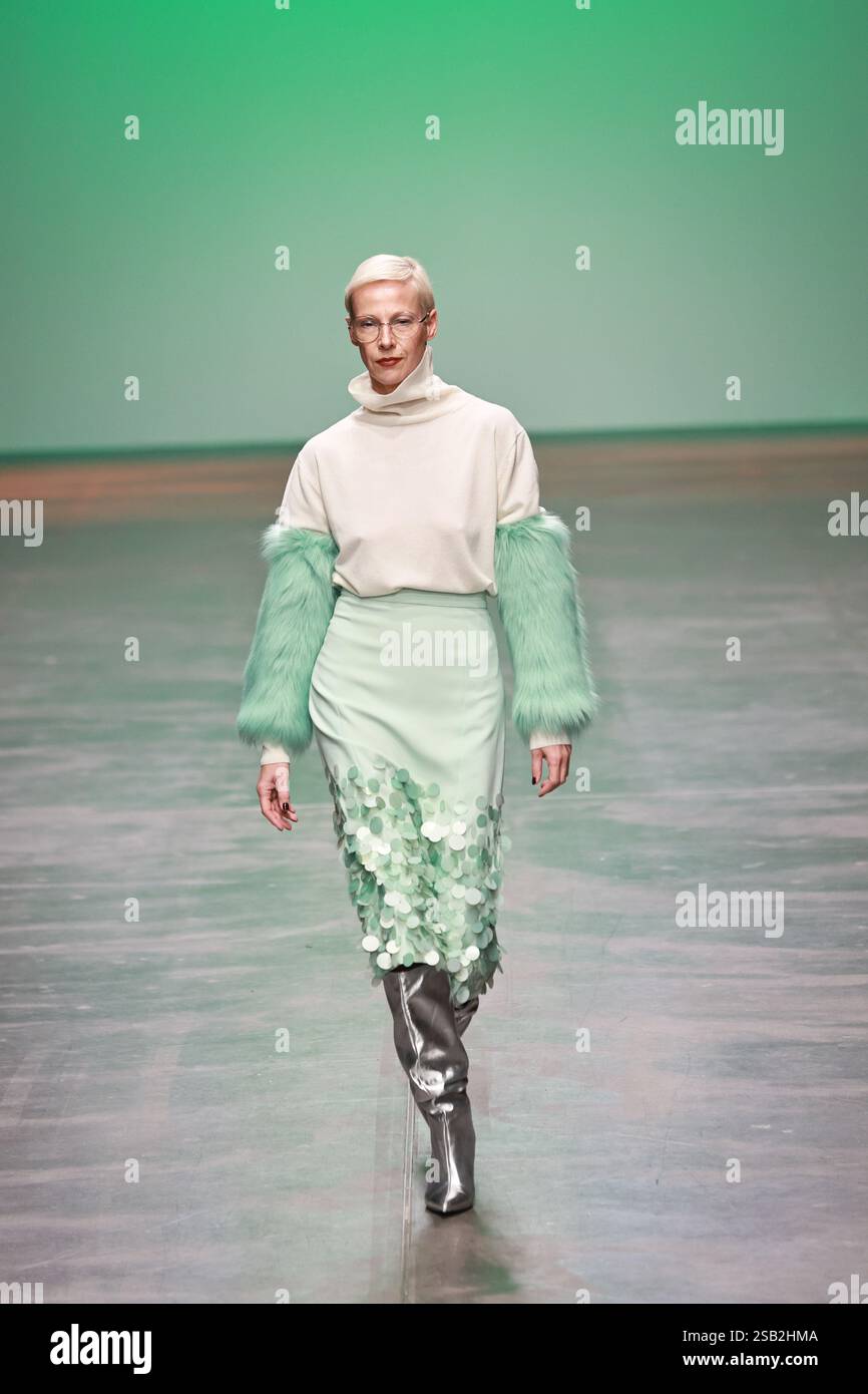 BERLIN, GERMANY - January 31: A model walks the runway during the ...