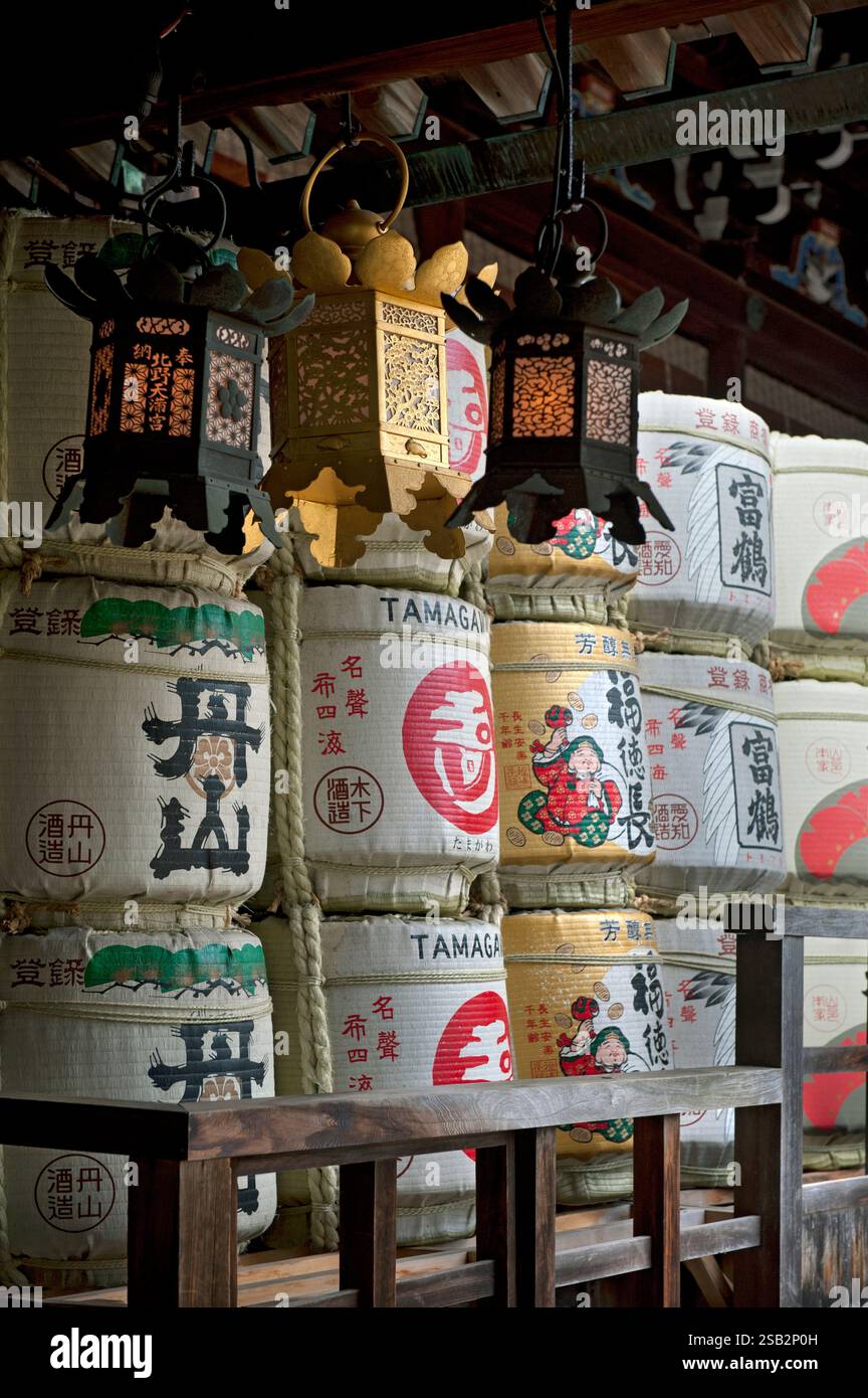 Japanese "sakadaru" (rice wine sake barrels) stacked as an offering to ...