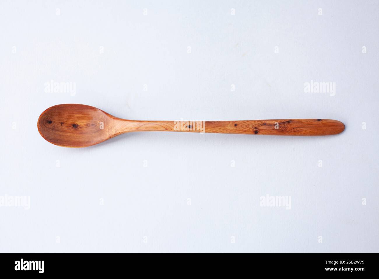 Wooden kitchen utensils stacked view, spoon and spatula Stock Photo - Alamy