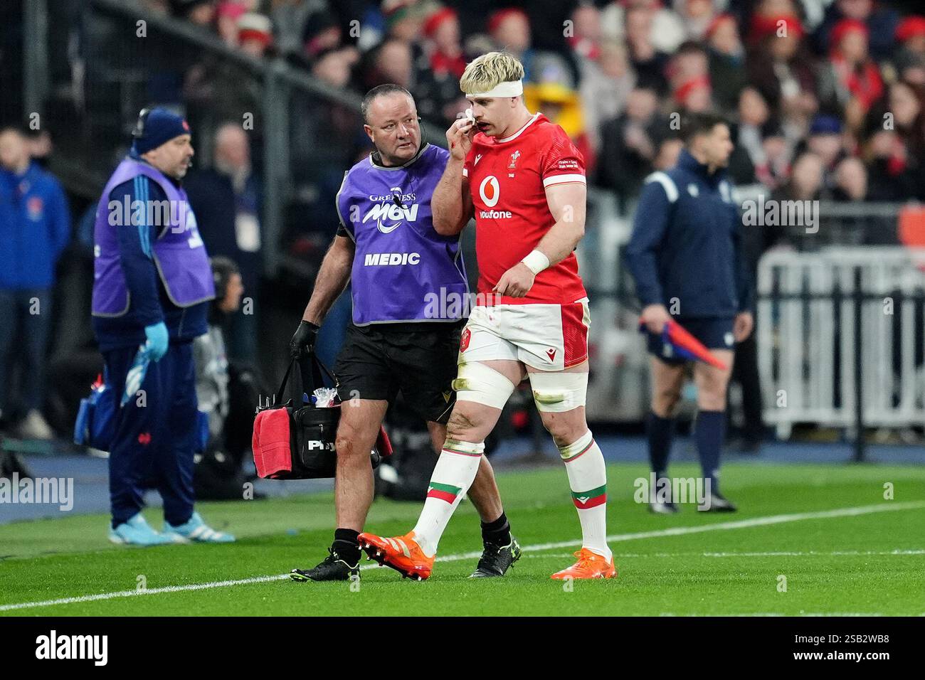 Wales' Aaron Wainwright leaves the field after going down injured and ...