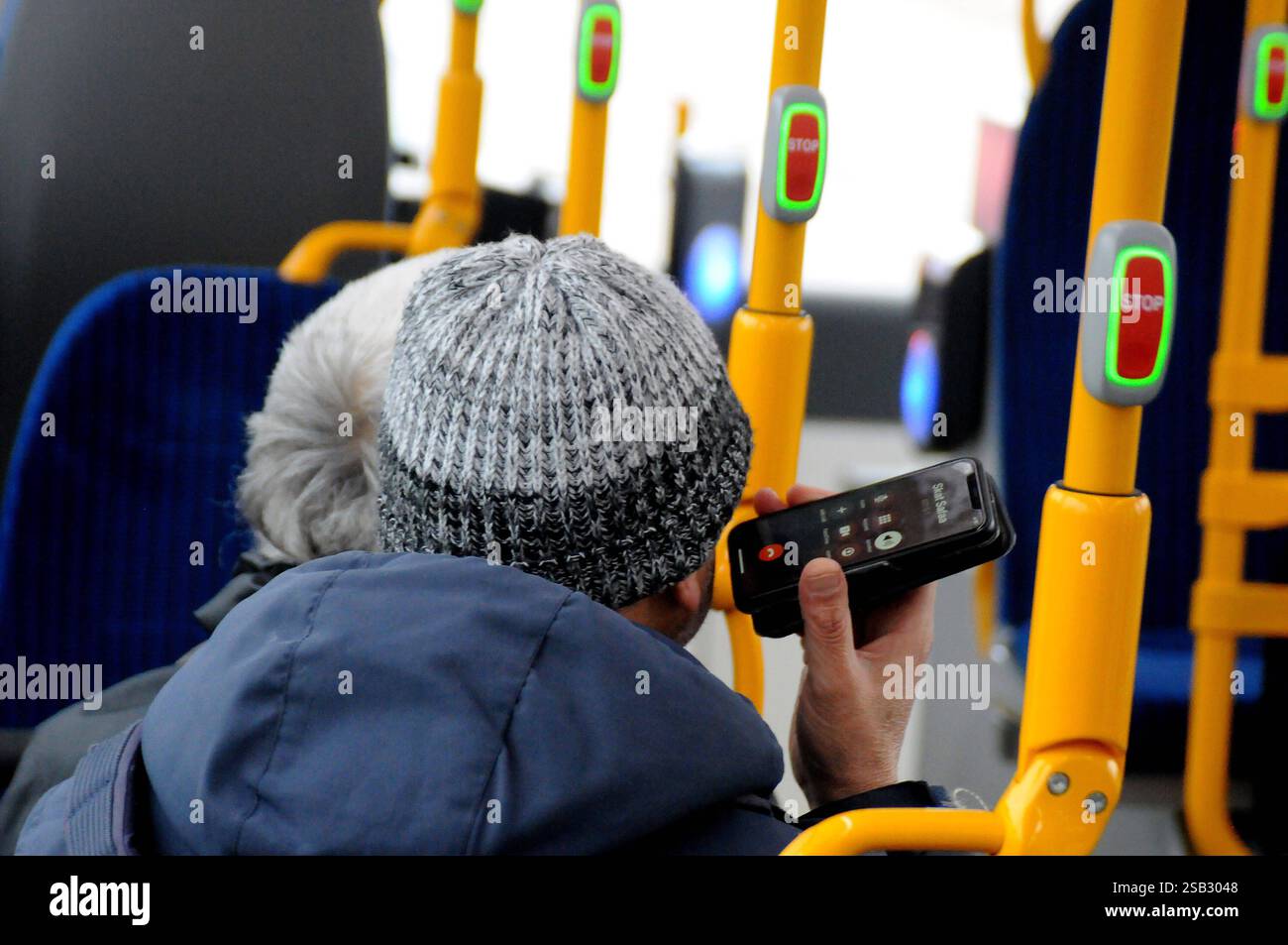 Copenhagen/ DenmarK/31 JANUARY 2025/ Bus passengers use ehad phone ...