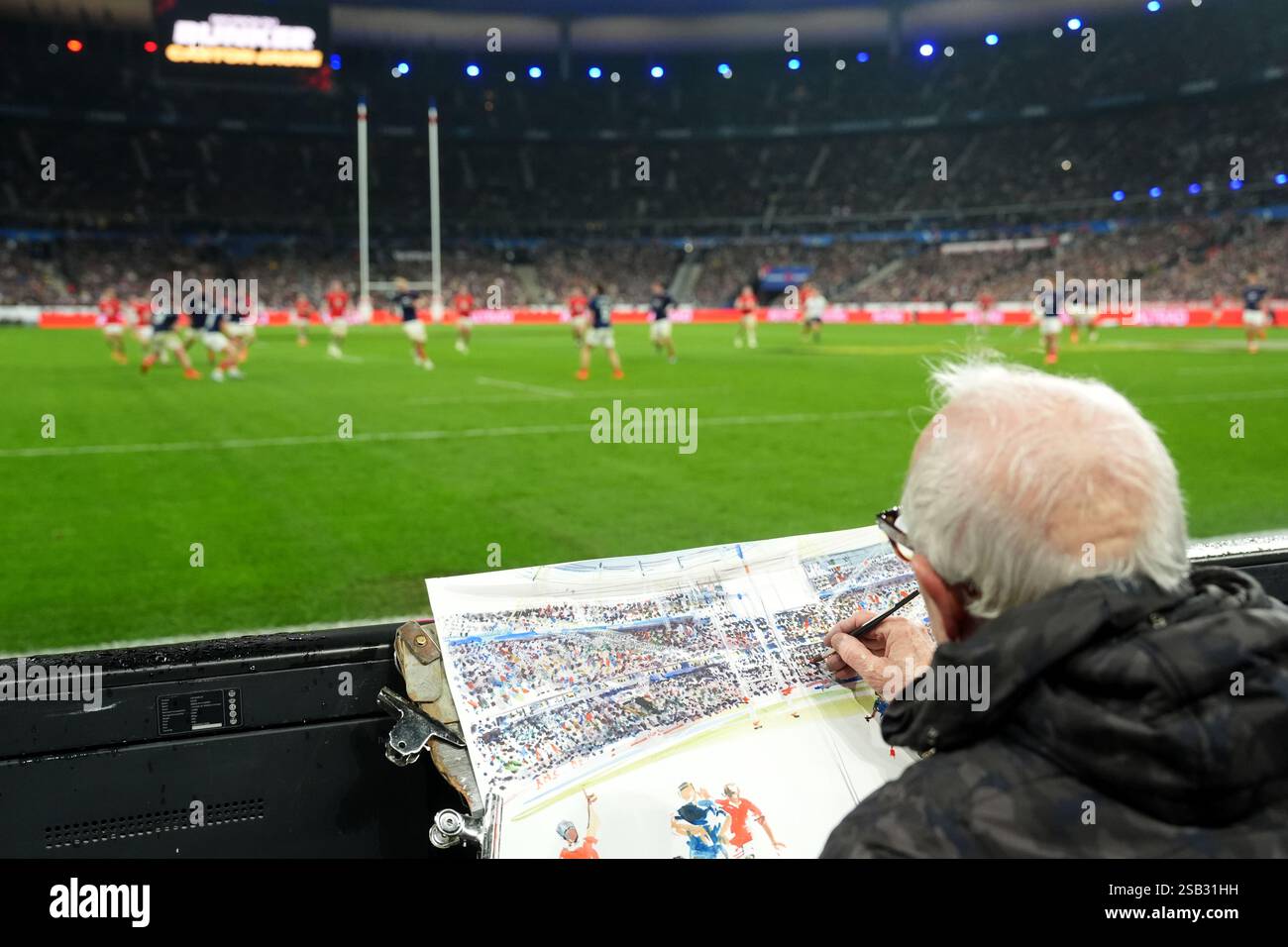 An artist paints match action pitch side during the Guinness Men's Six ...