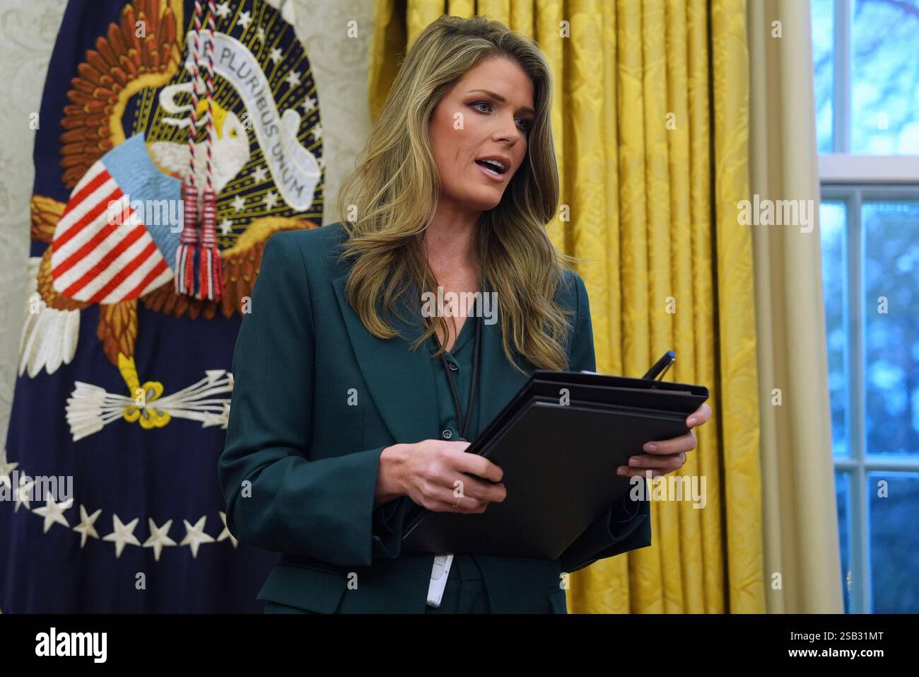 Lindsey Halligan speaks as President Donald Trump signs executive ...