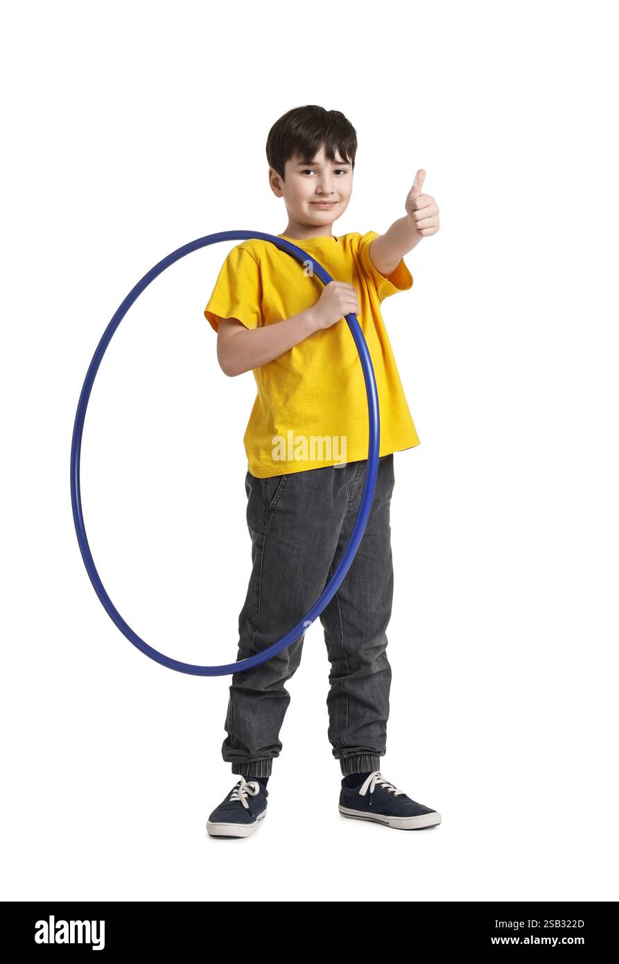 Boy with hula hoop showing thumbs up on white background Stock Photo ...
