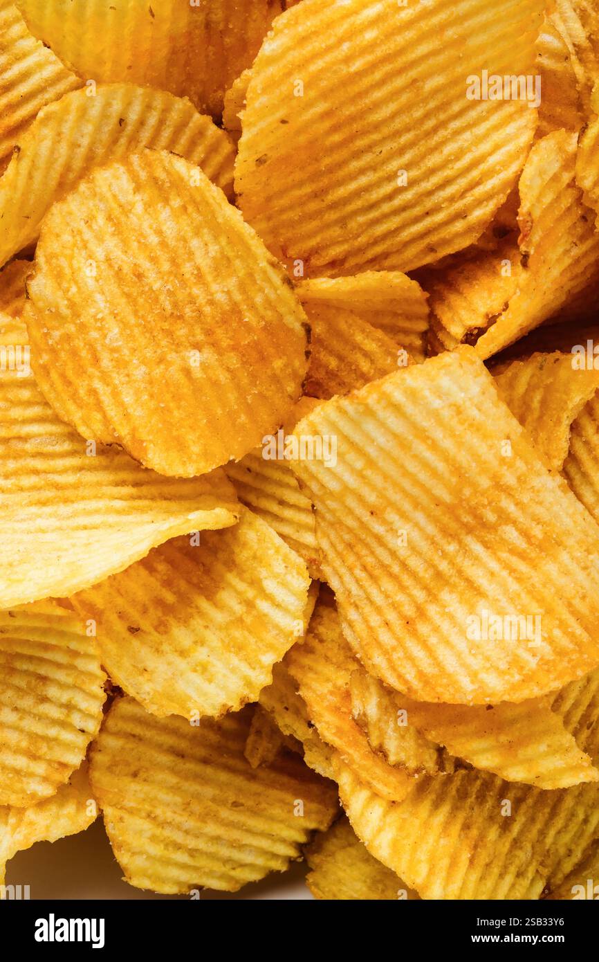 Wavy potato chips close-up, texture, background Stock Photo - Alamy
