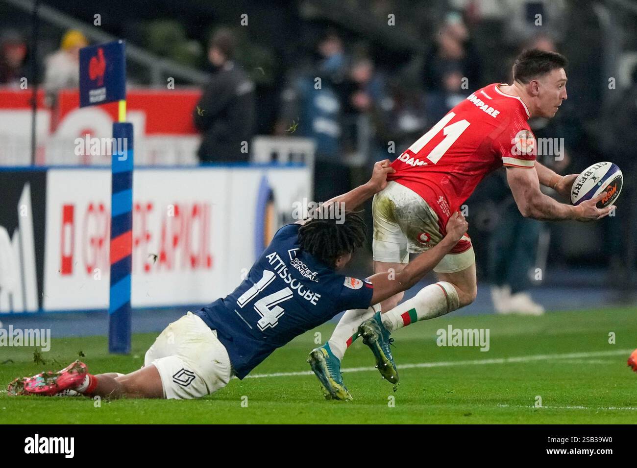 Wales' Josh Adams is tackled by France's Theo Attissogbe during the Six ...