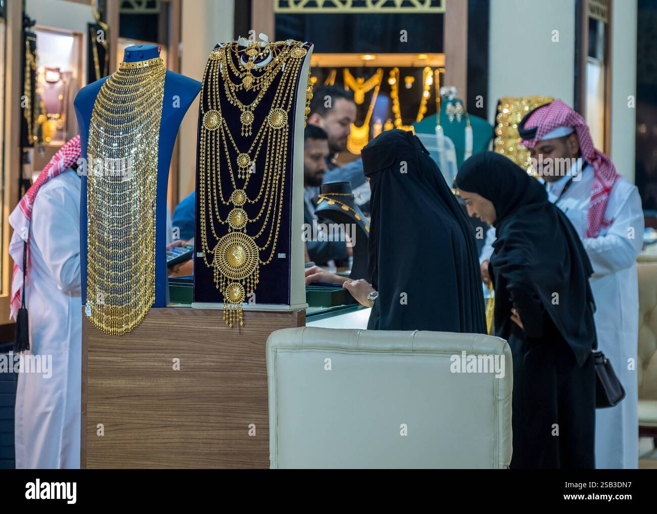 DOHA JEWELLERY AND WATCHES EXHIBITION People visit and look at gold and ...